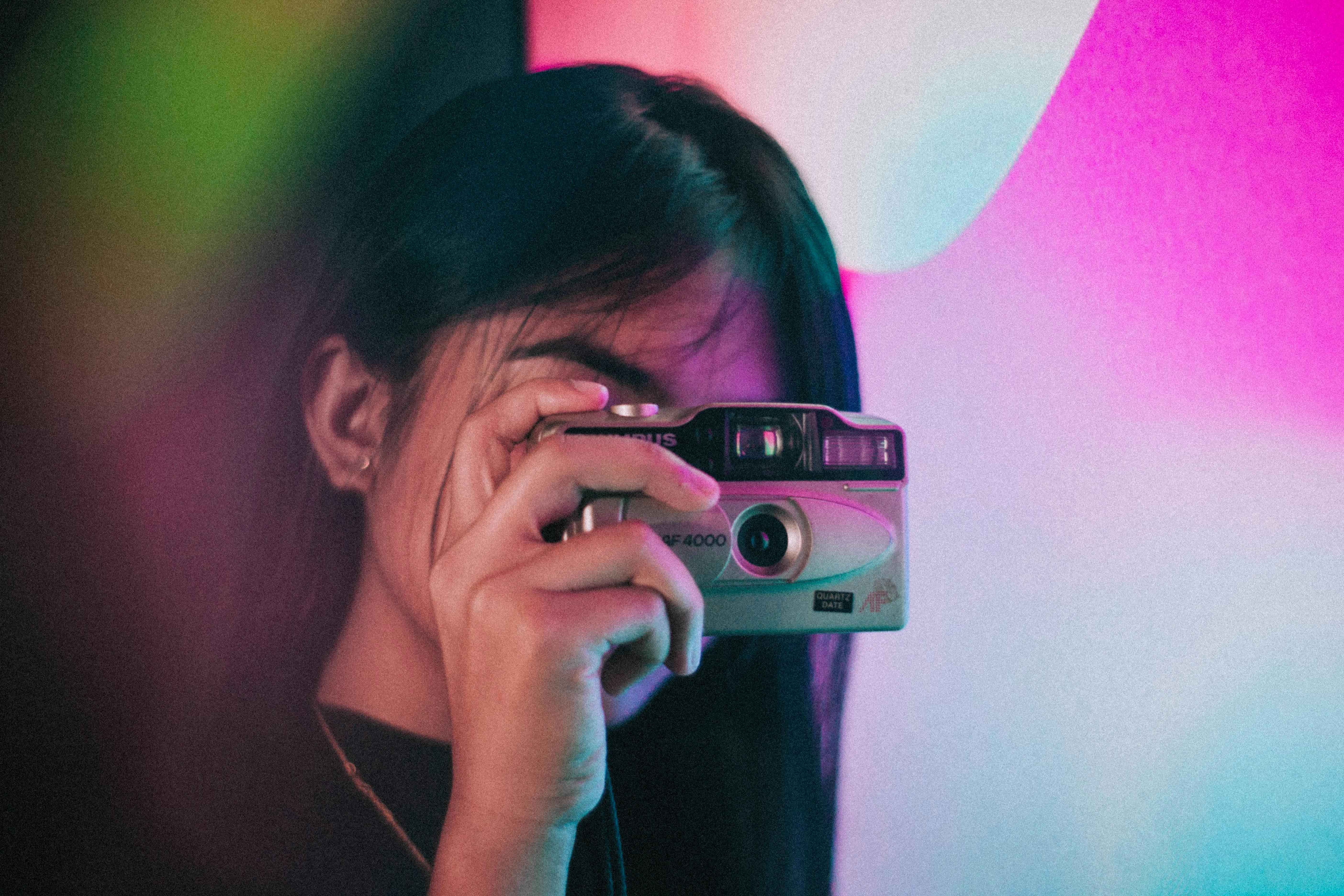 Woman Holding Camera · Free Stock Photo