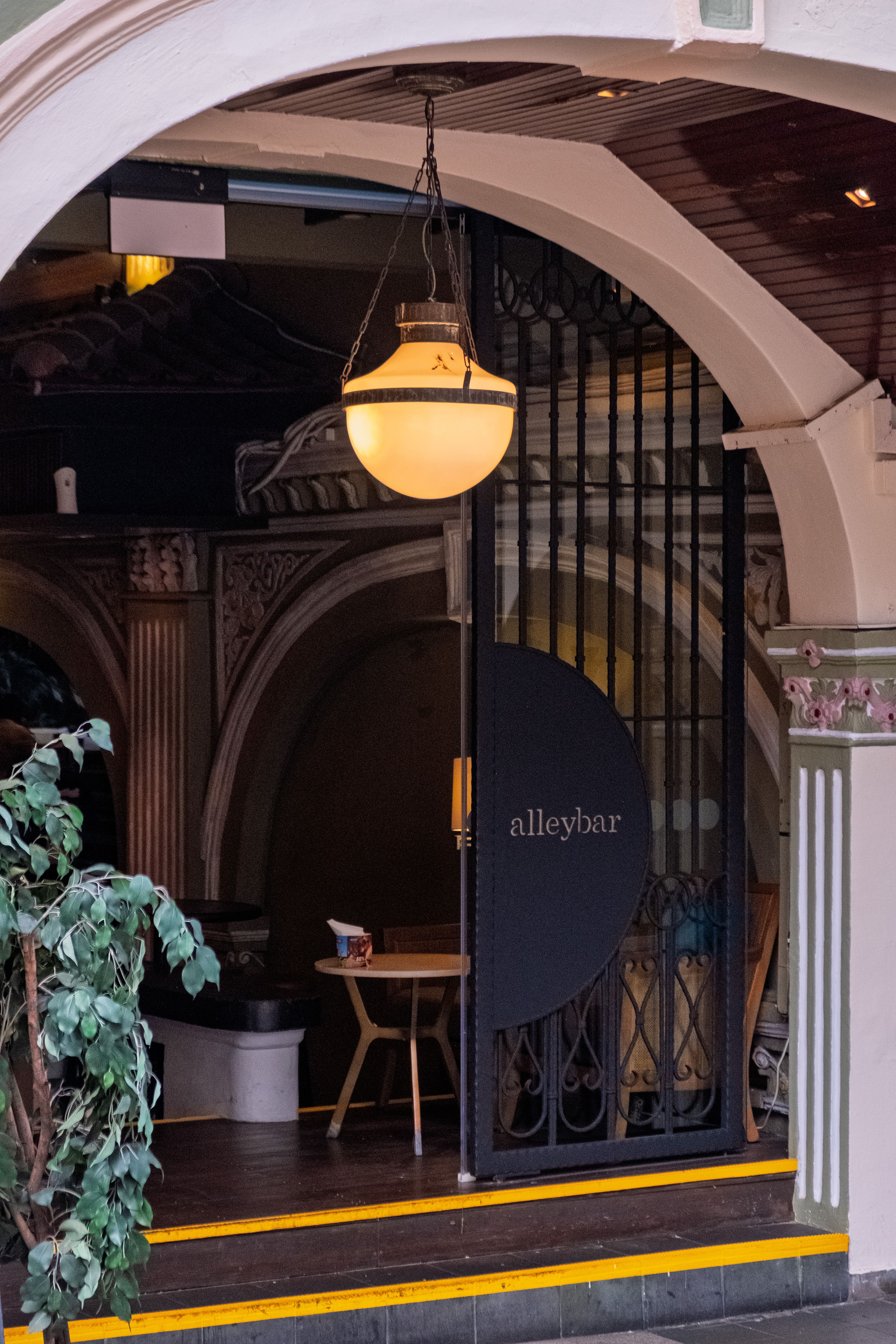 Cozy Entrance to a Dimly Lit Alley Bar · Free Stock Photo