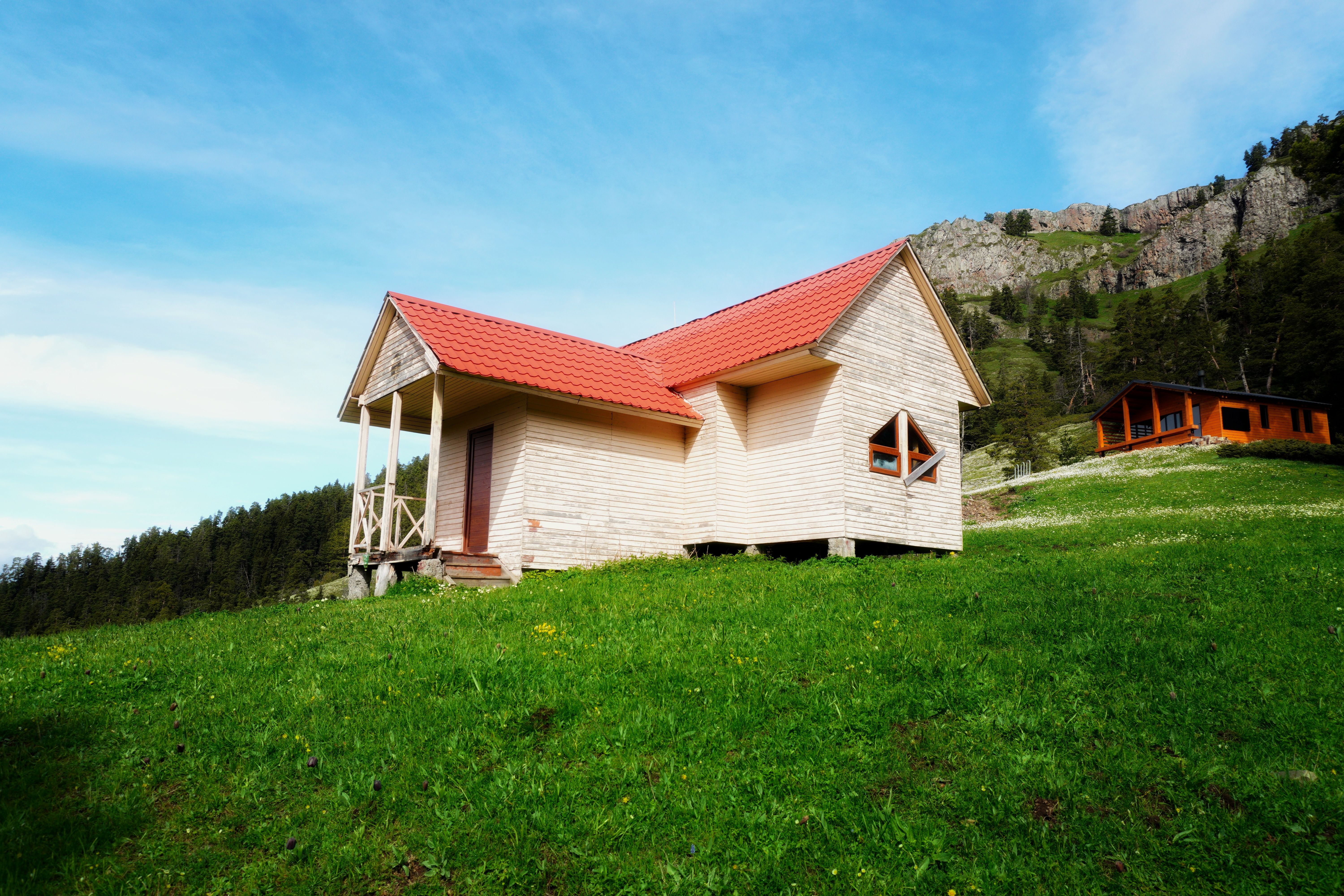Scenic Mountain Cabin with Red Roof · Free Stock Photo