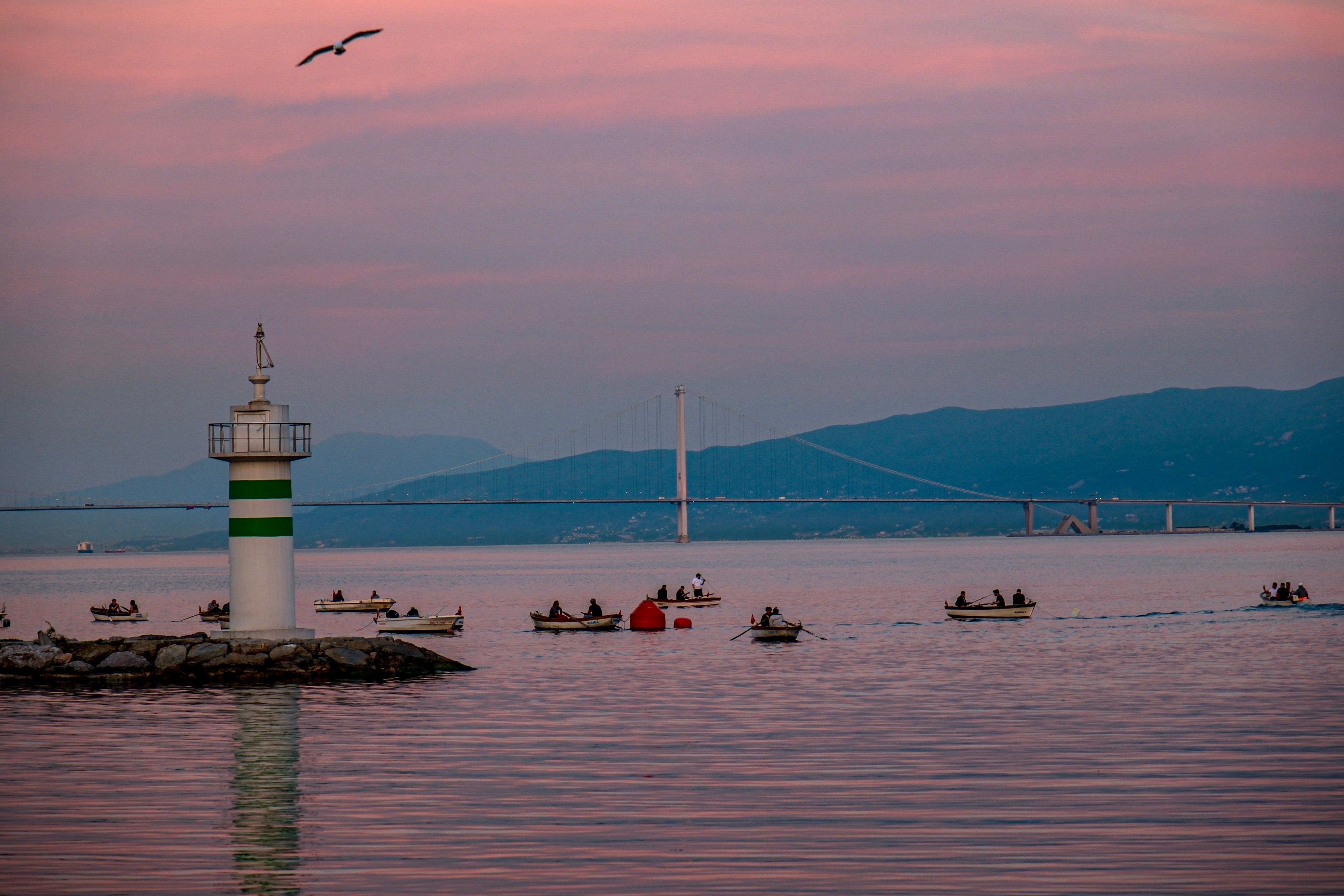 Peaceful Sunset at İzmit Bay with Boats and Lighthouse · Free Stock Photo