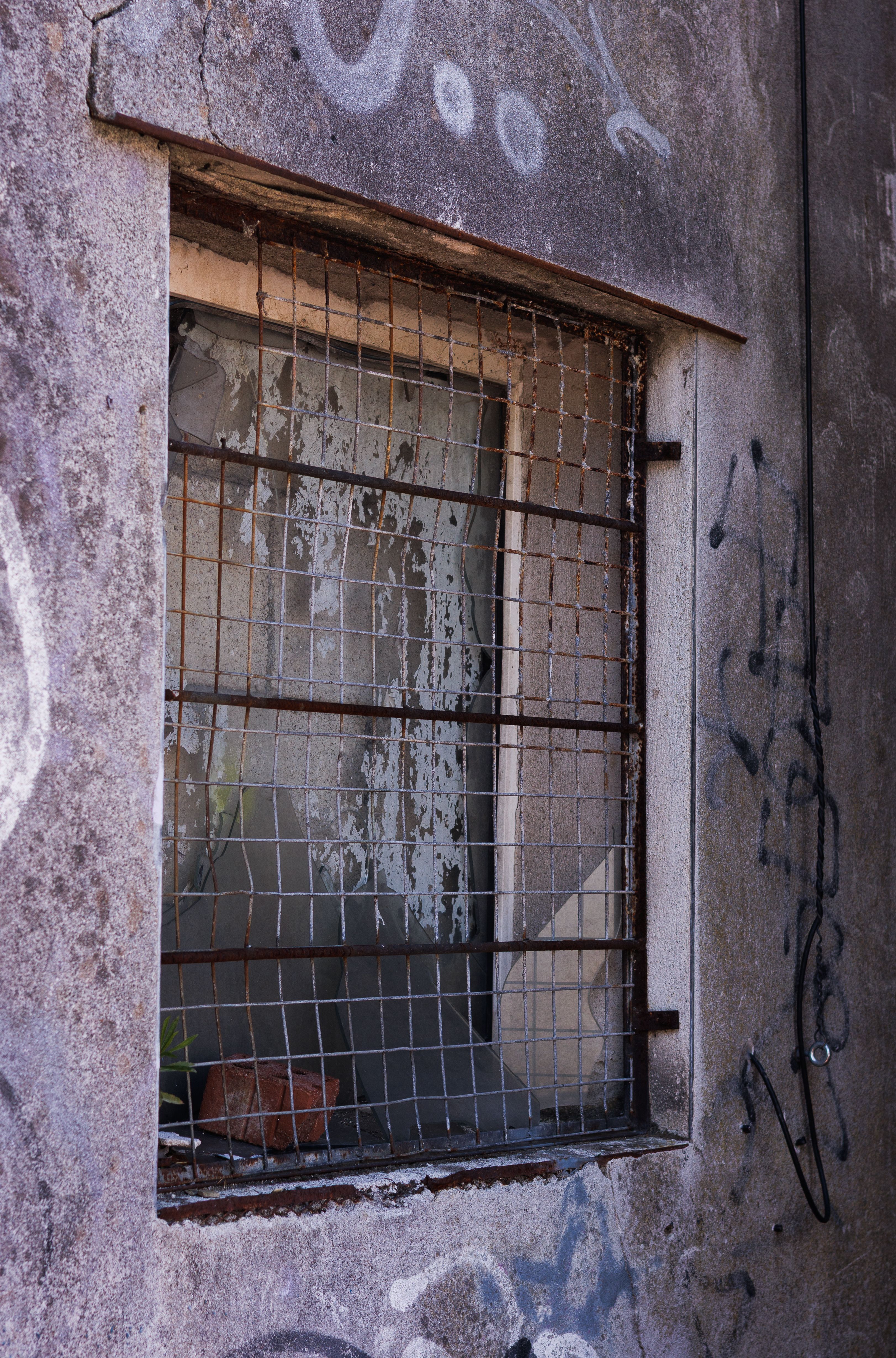 Rustic Window with Graffiti on Urban Wall · Free Stock Photo