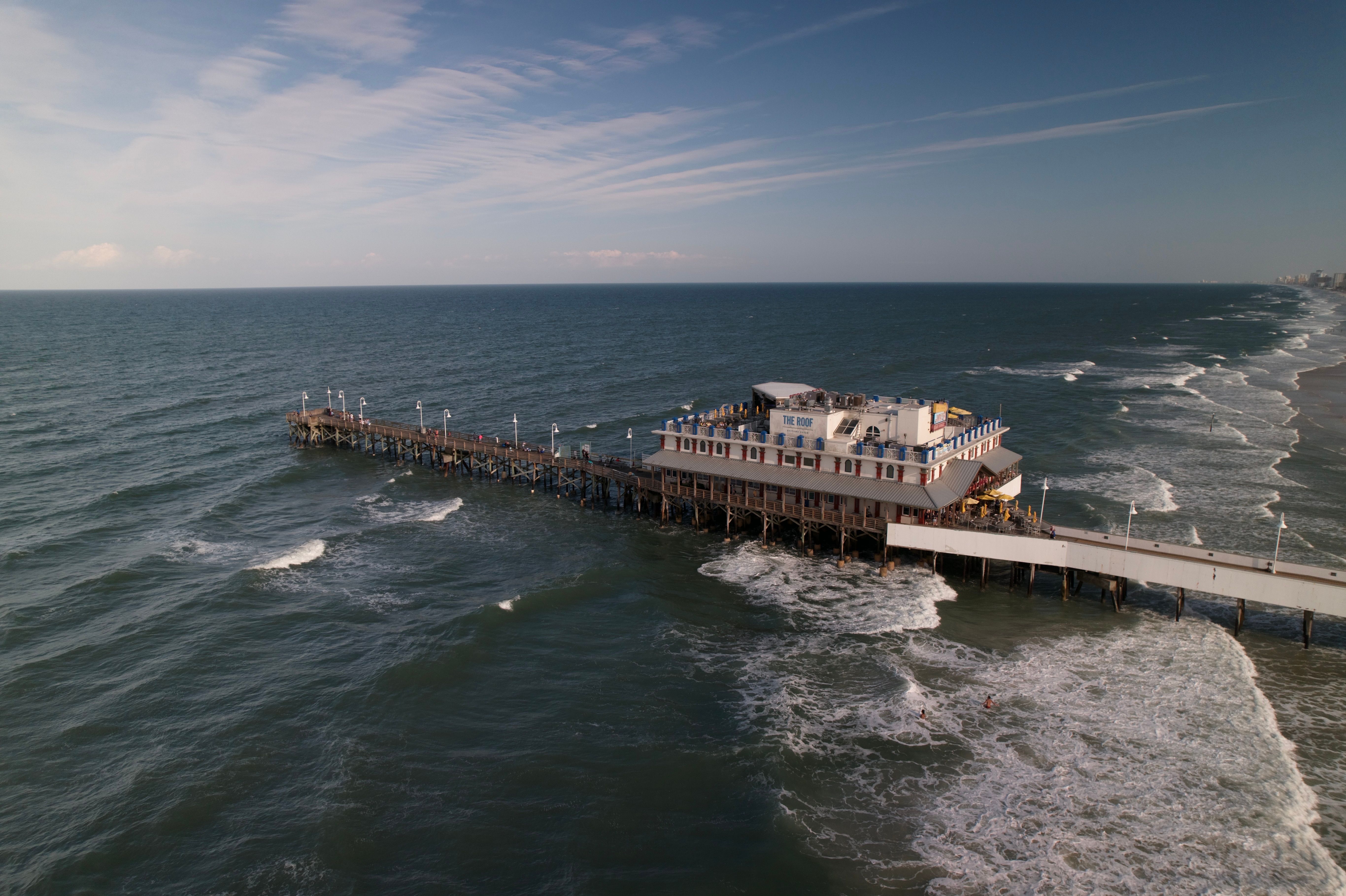 Scenic Aerial View of a Beachside Pier · Free Stock Photo
