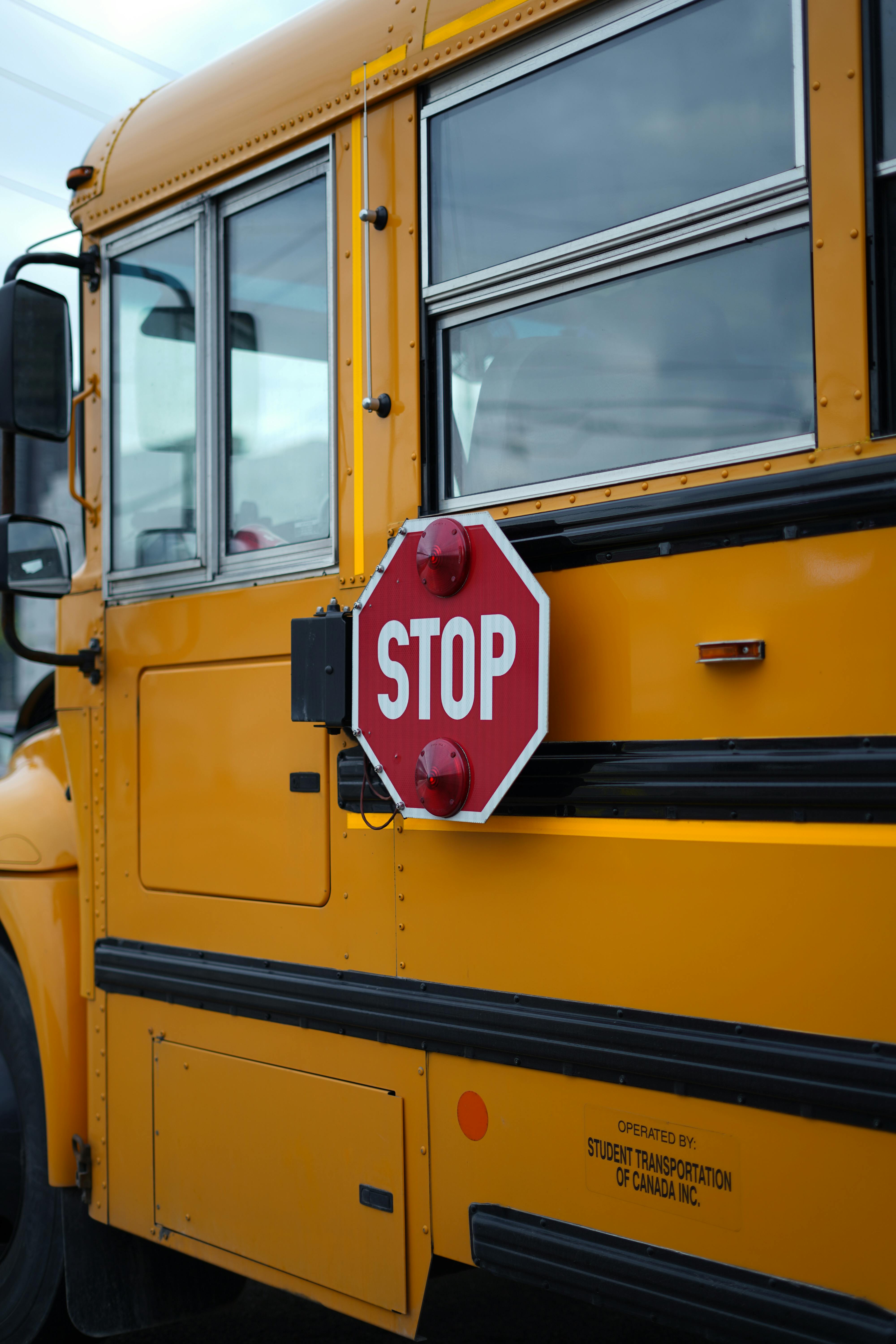 Close-up of a Yellow School Bus with Stop Sign · Free Stock Photo