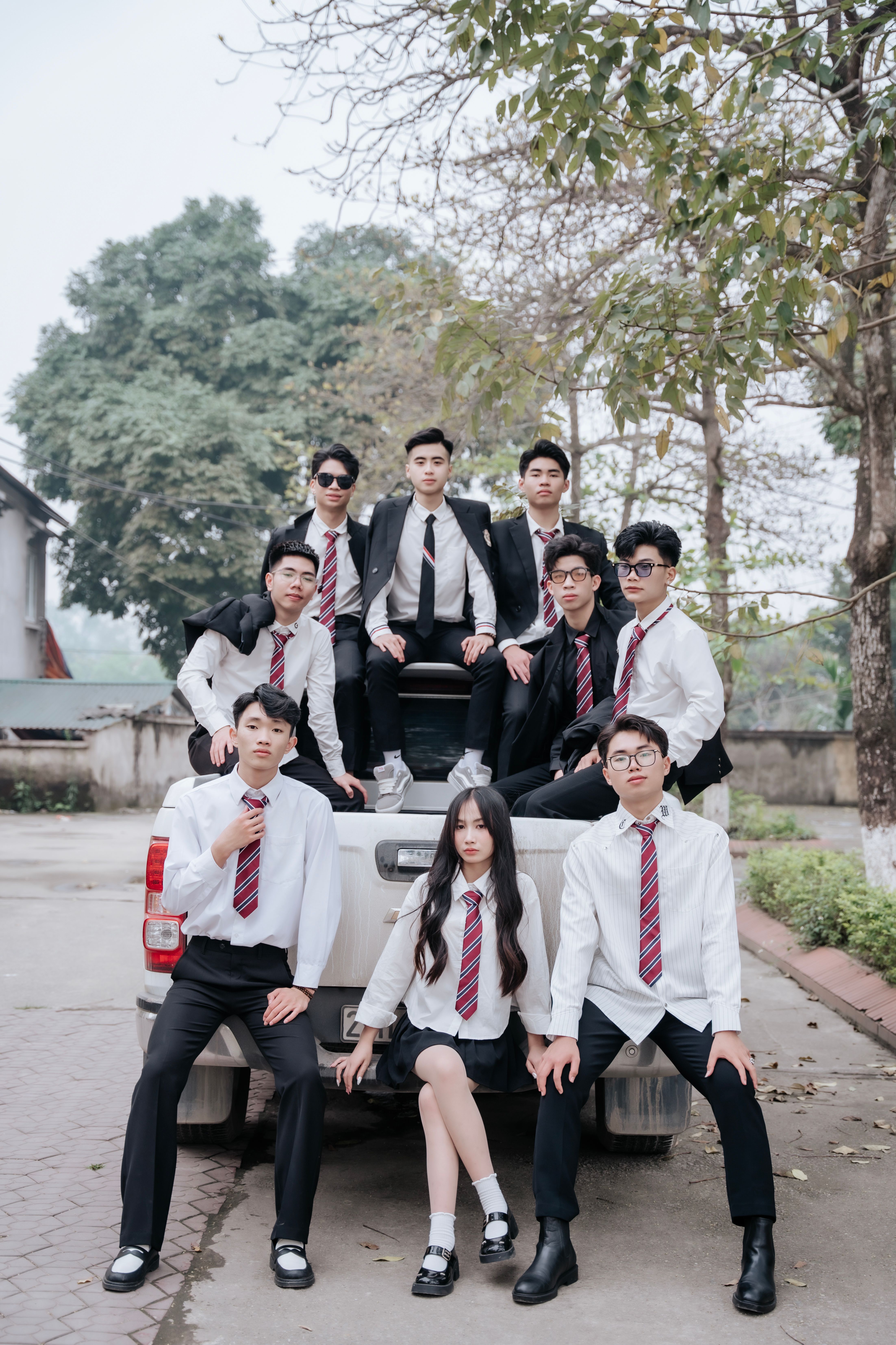Group of Students in Uniforms Posing Outdoors · Free Stock Photo