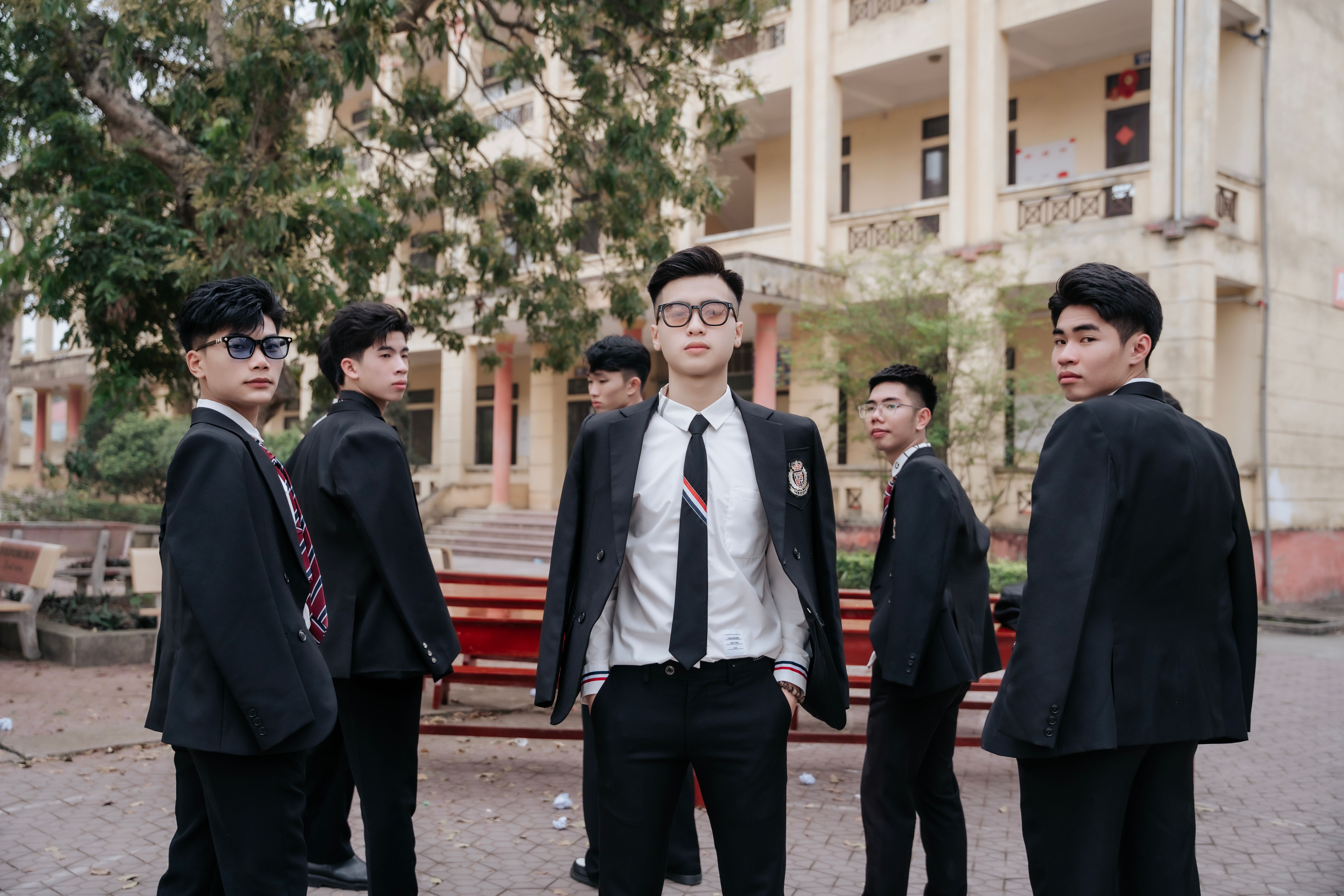 Group of Young Men in School Uniforms Outdoors · Free Stock Photo