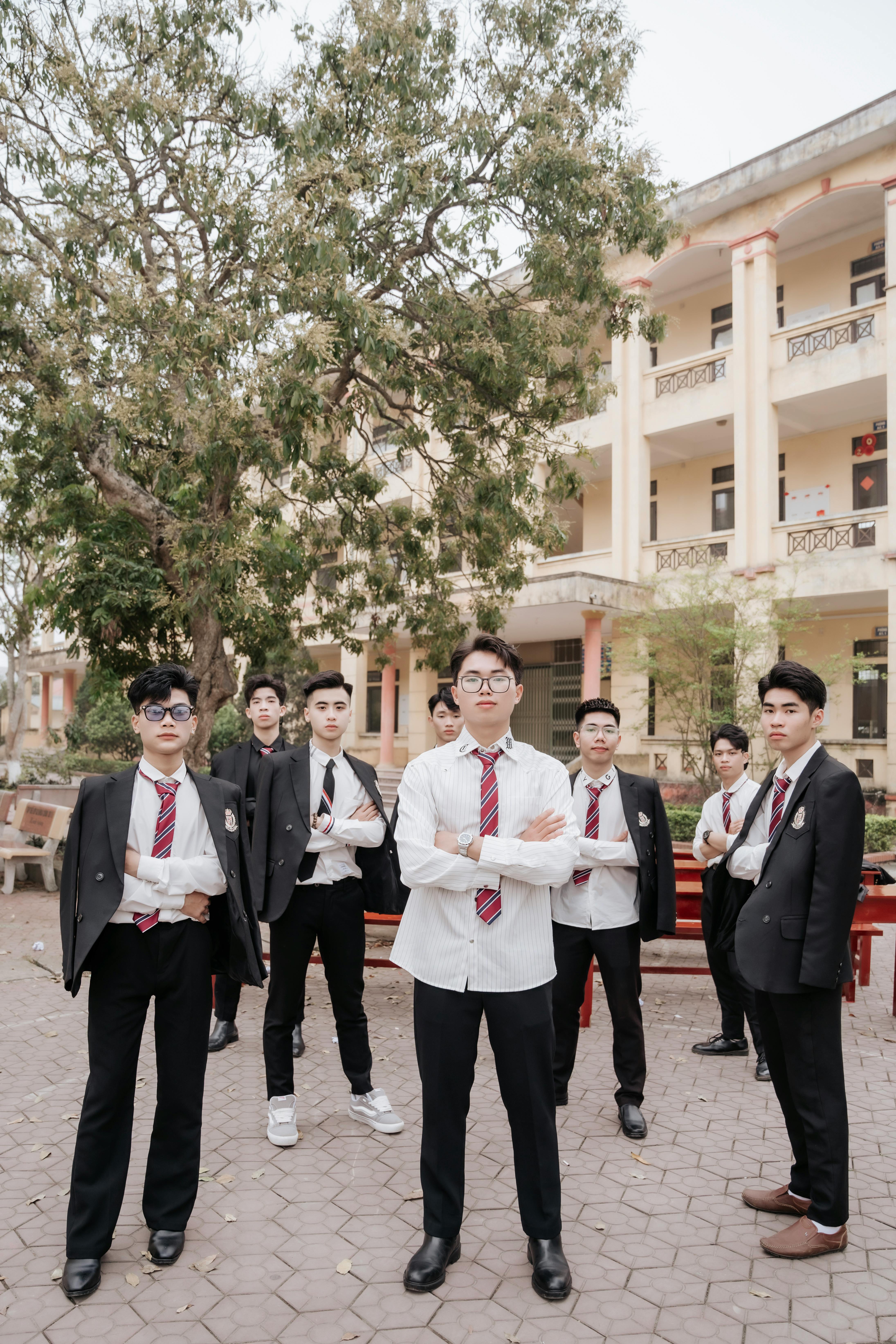 Group of High School Students in Uniform Outdoors · Free Stock Photo