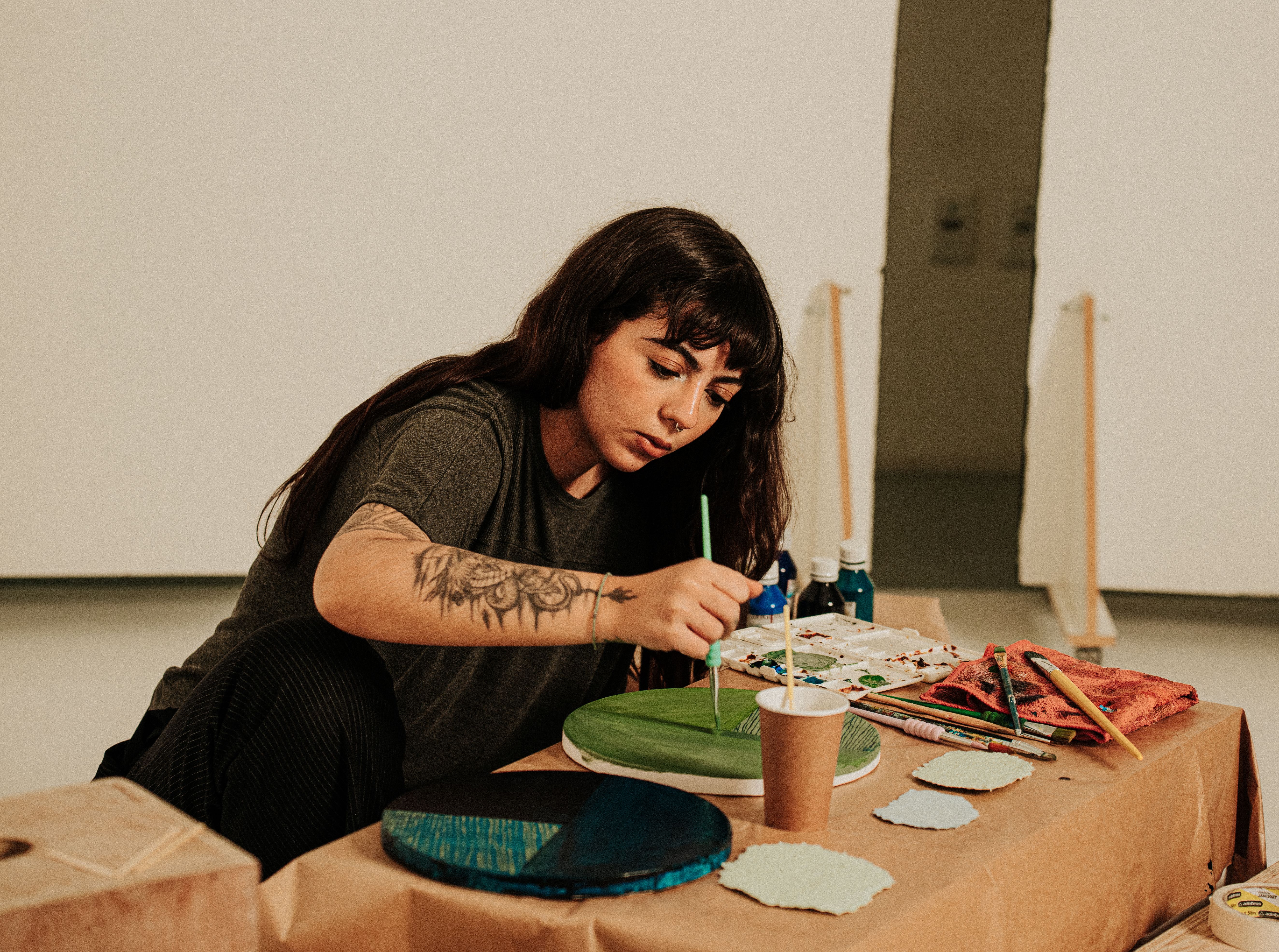 Female Artist Painting in Studio Environment · Free Stock Photo