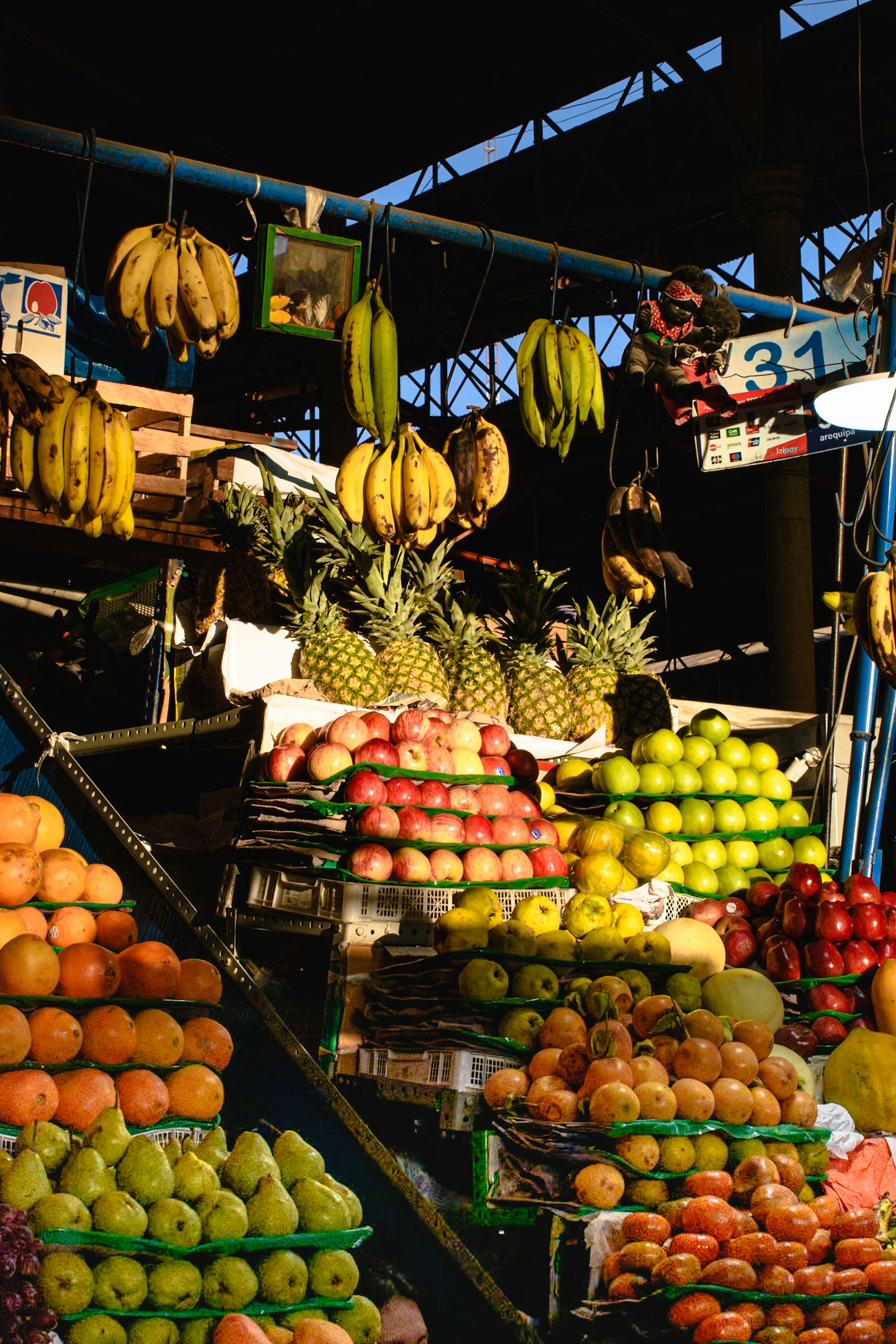 Vibrant Fruit Market Display with Sunlight · Free Stock Photo