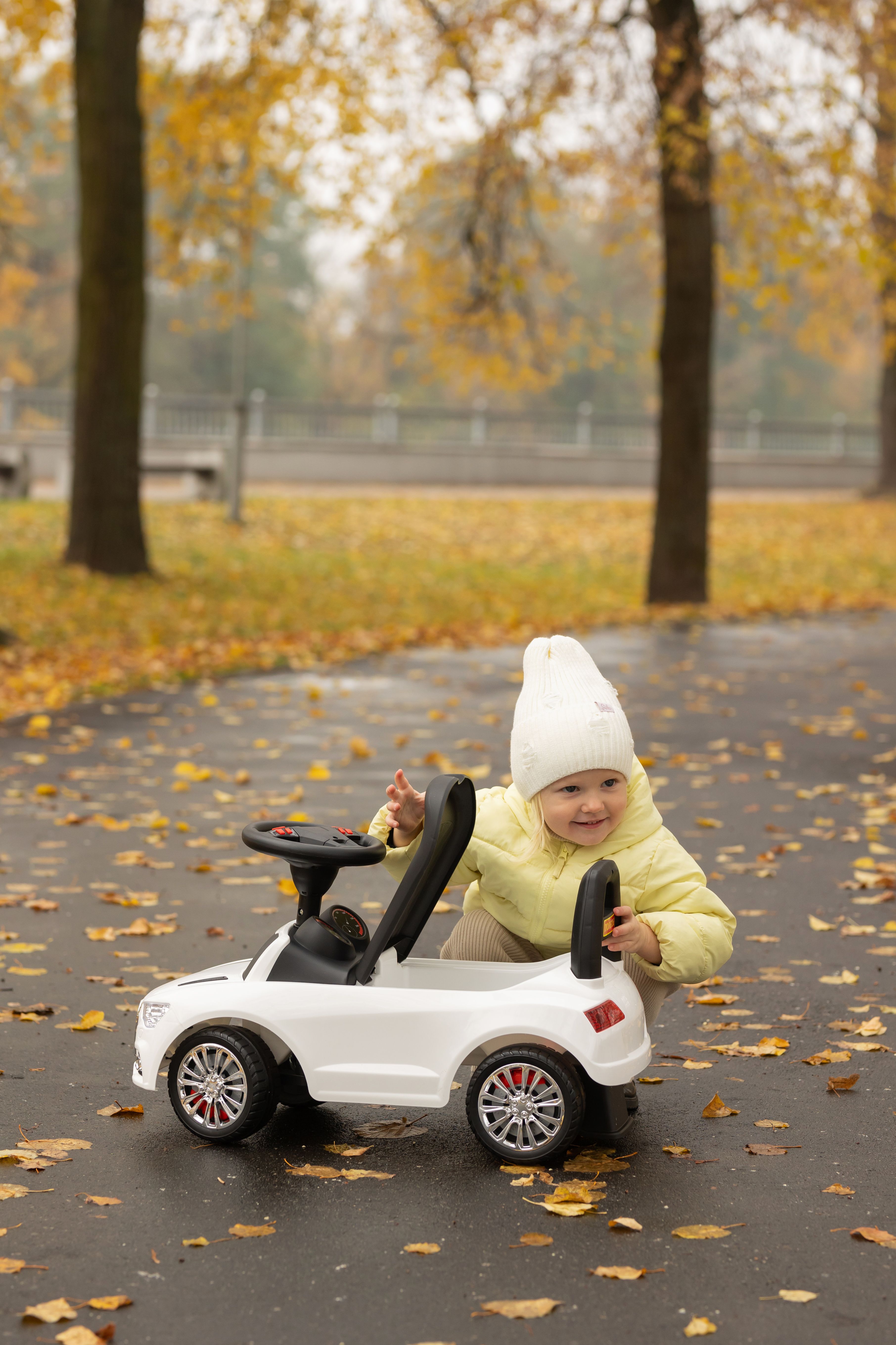 Little Boy Next to a Toy Car · Free Stock Photo