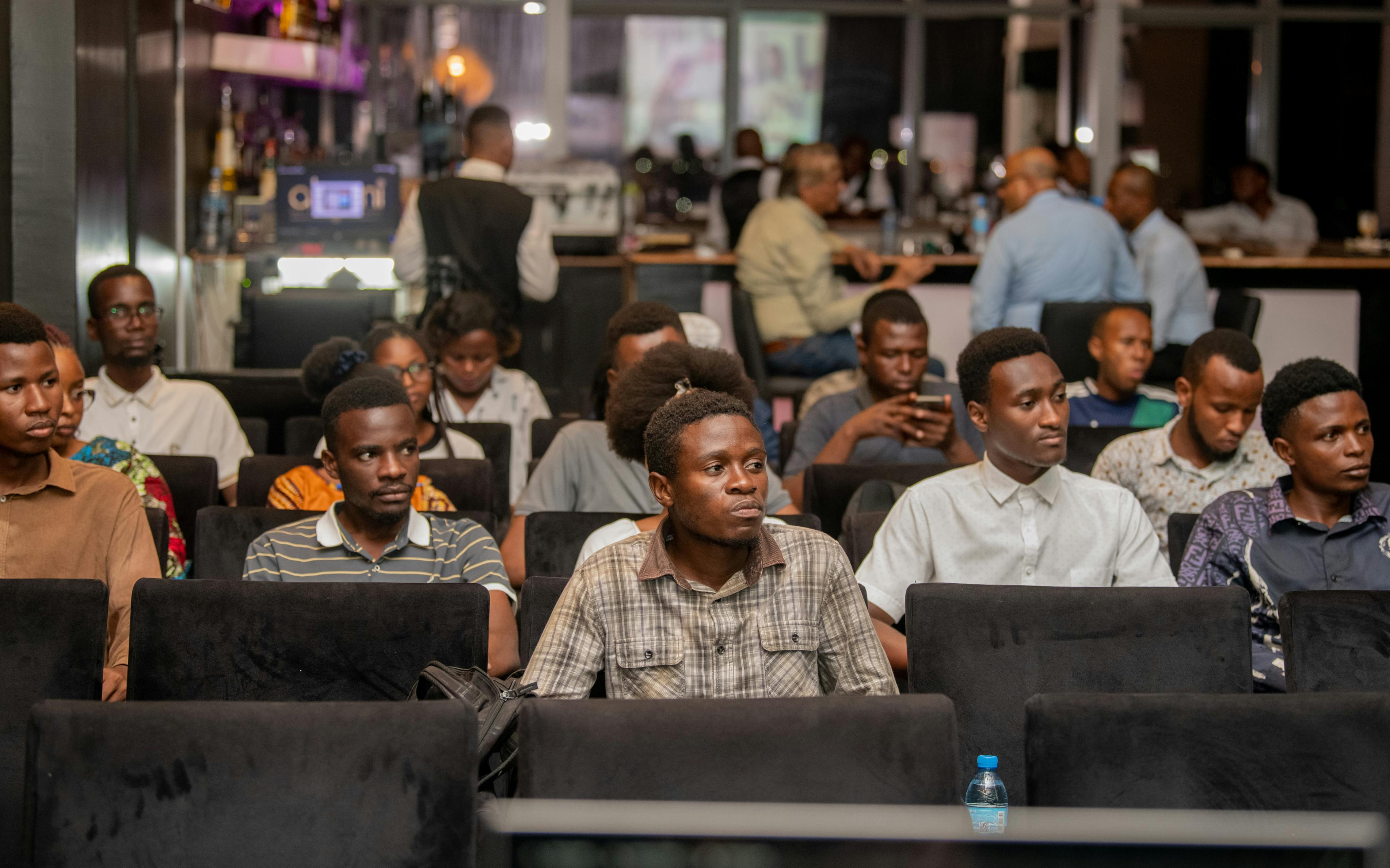 Young Adults Attending Indoor Conference · Free Stock Photo