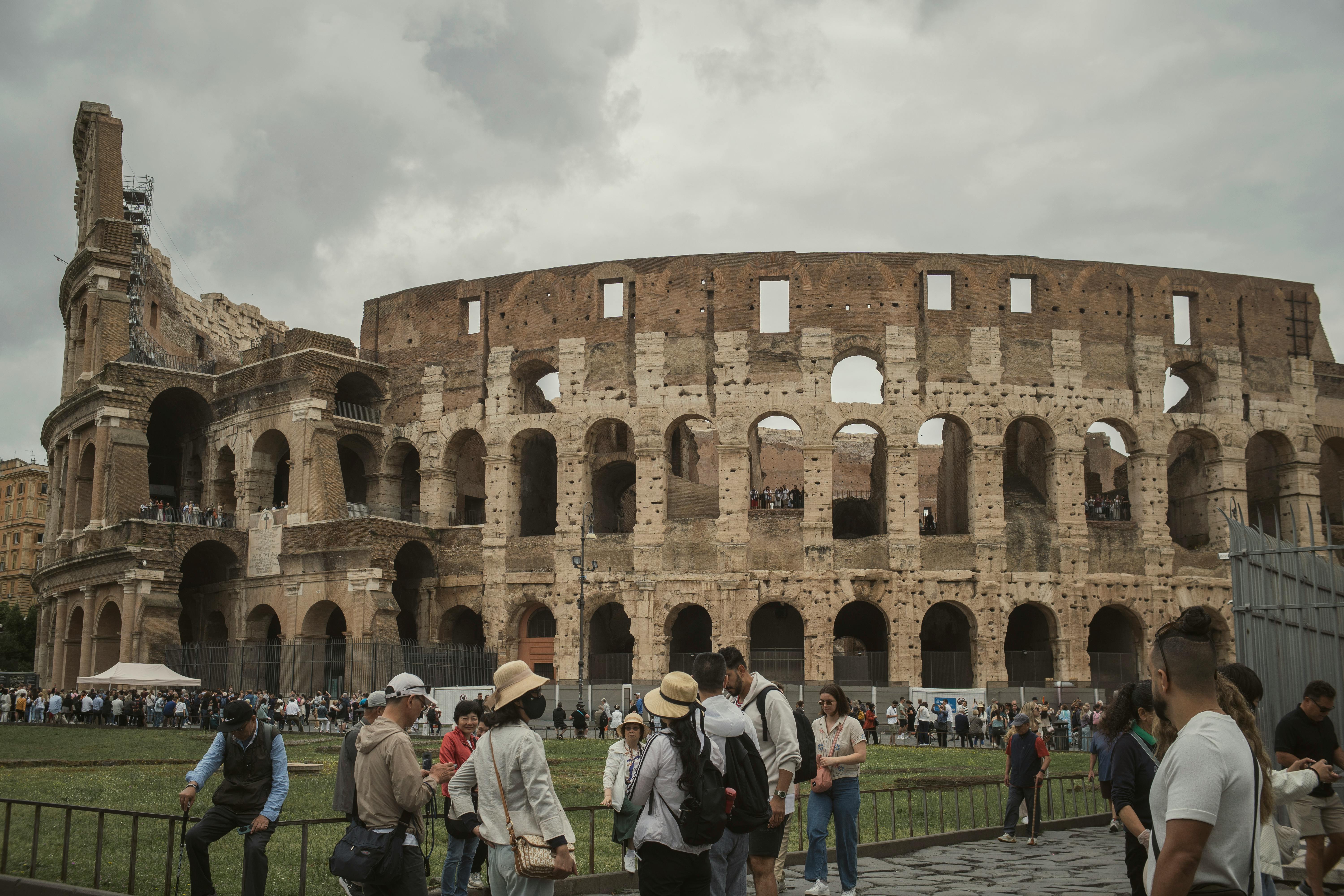 Tourists Exploring Iconic Colosseum in Rome · Free Stock Photo
