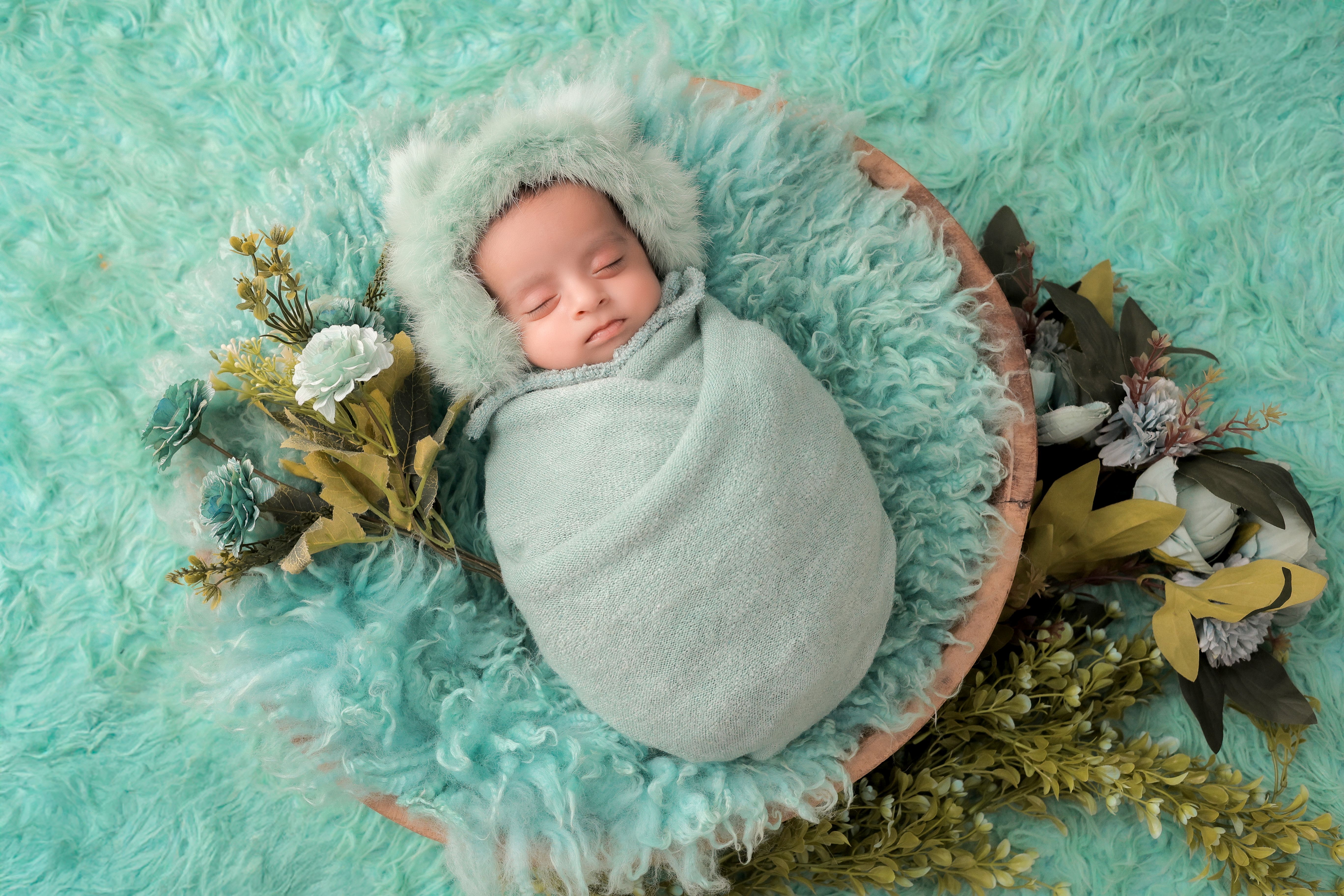 Adorable Baby Wrapped in Soft Mint Blanket · Free Stock Photo