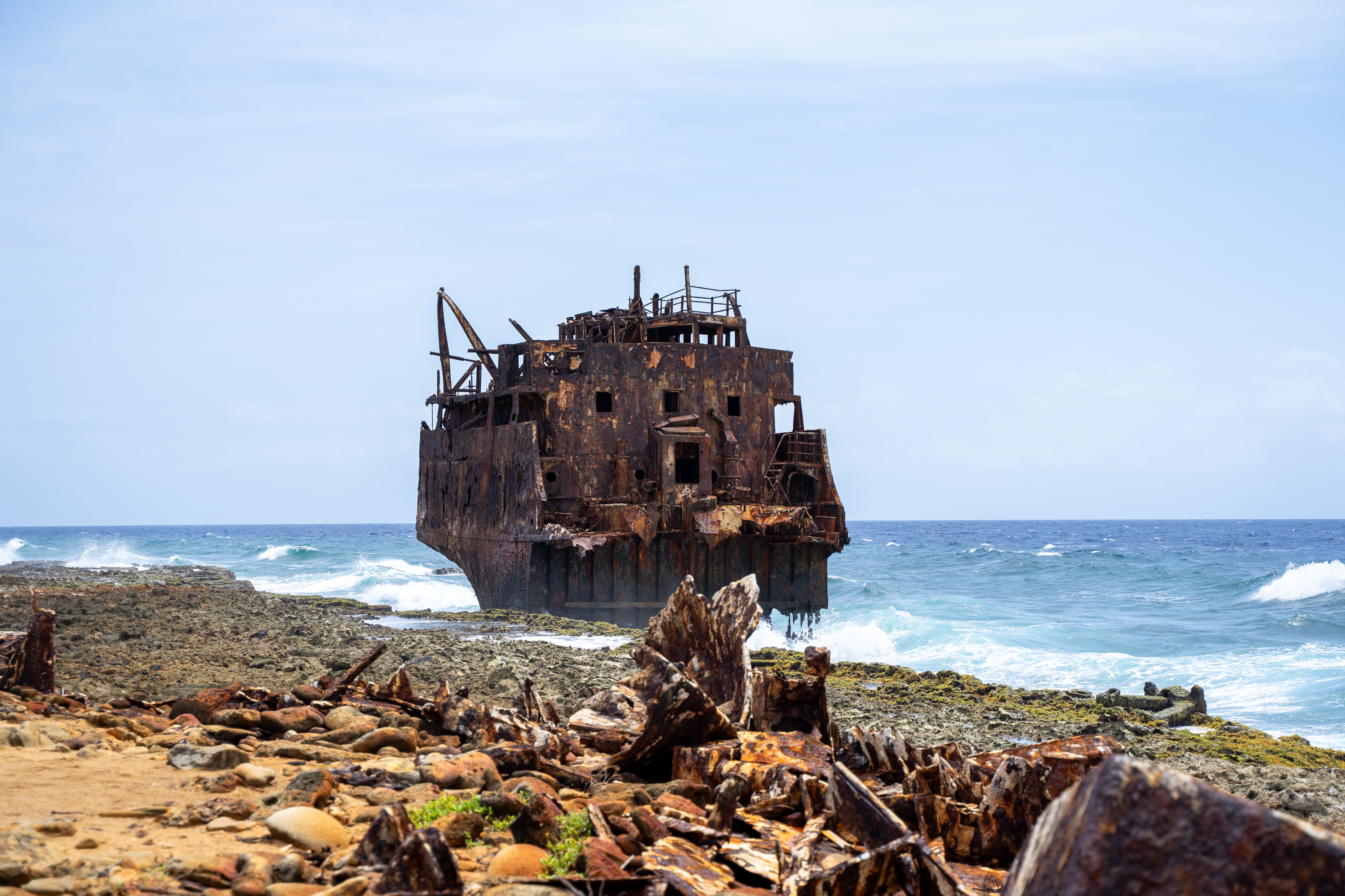 Rusty Shipwreck on Rocky Shore in Curaçao · Free Stock Photo