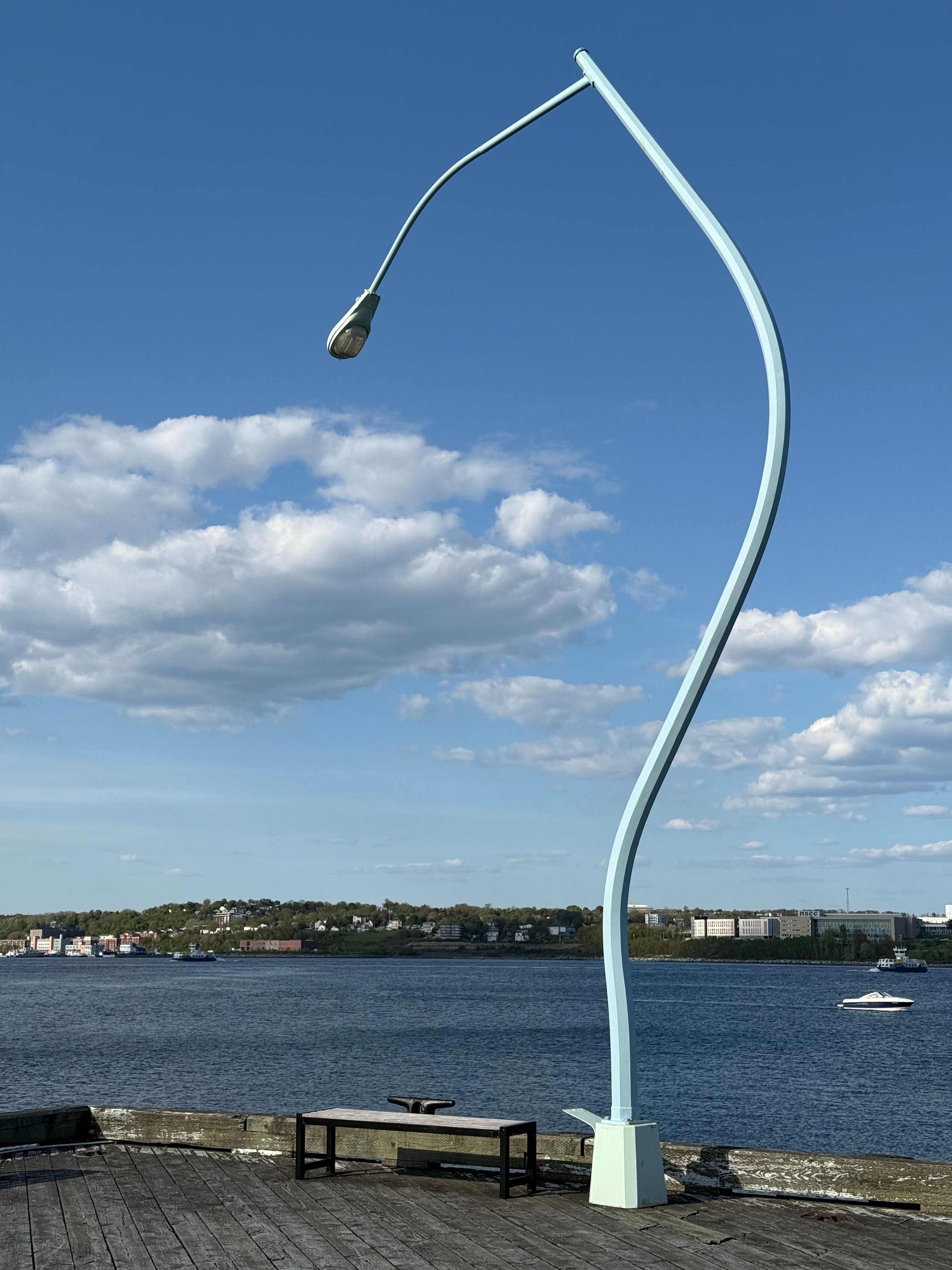 Curved Street Lamp by the Waterfront · Free Stock Photo