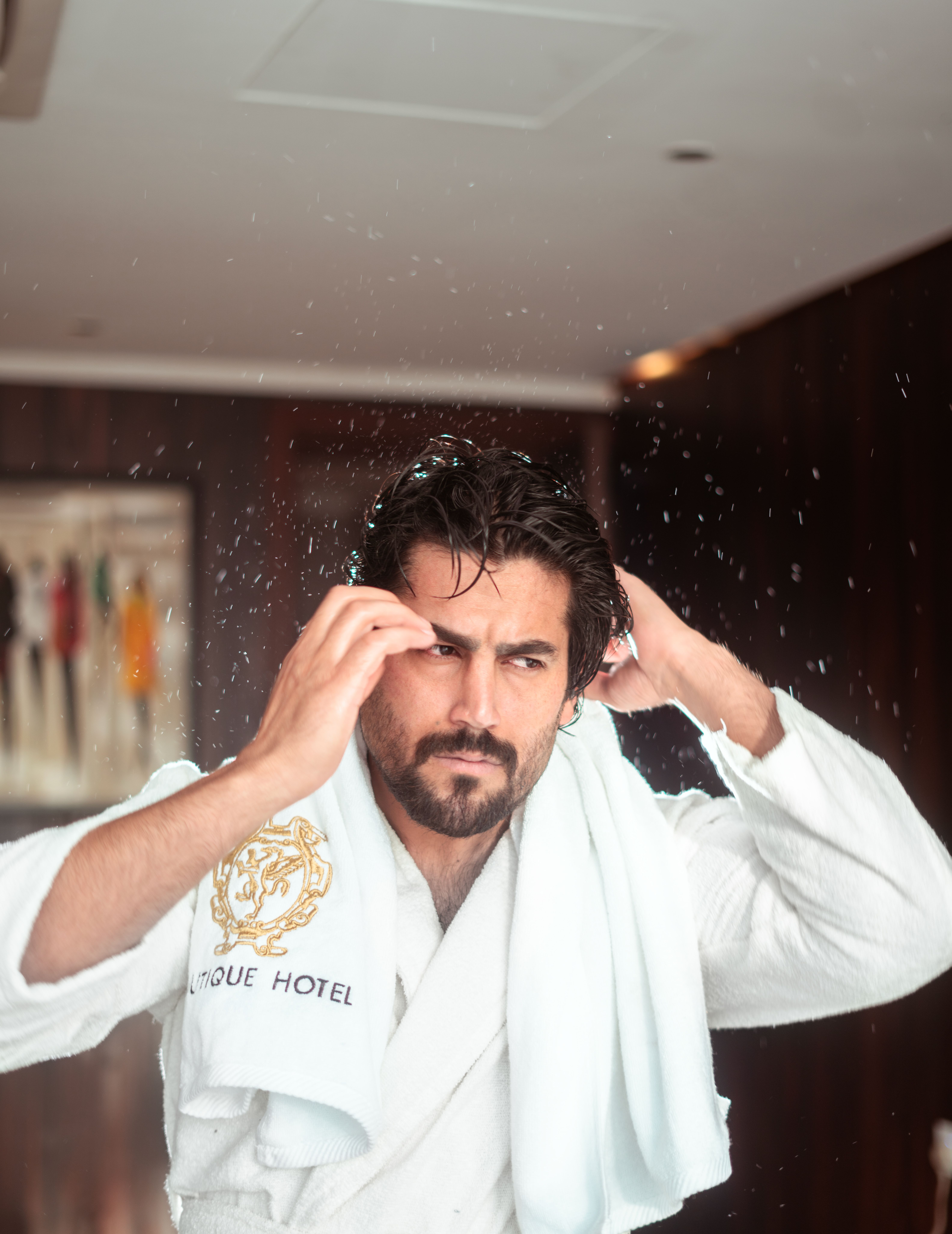 Man Grooming in Luxury Hotel Room · Free Stock Photo