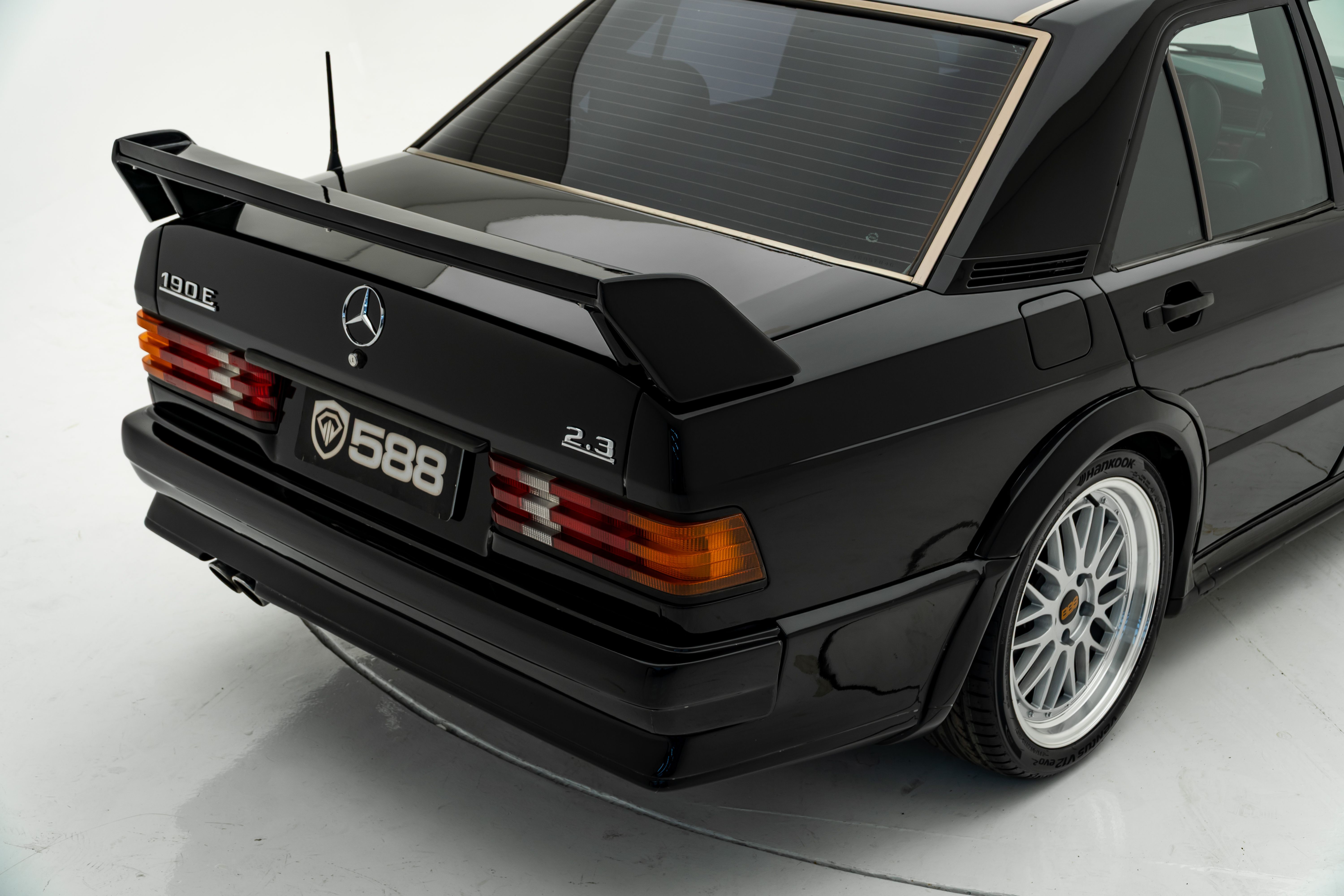 Mercedes 190E Black Car Rear View on Minimalist Background · Free Stock ...