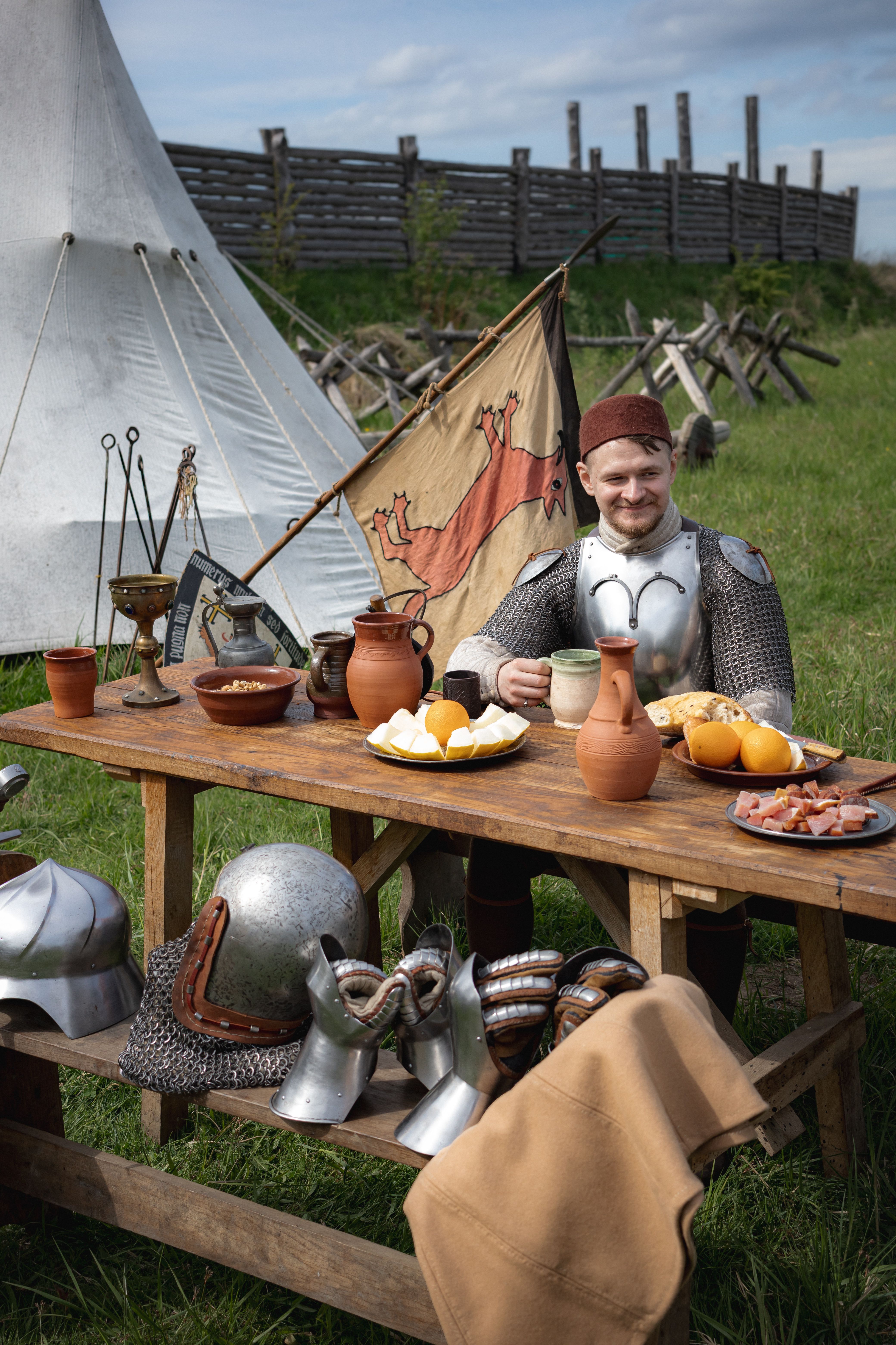 Medieval Knight Enjoying Feast at Historical Camp · Free Stock Photo