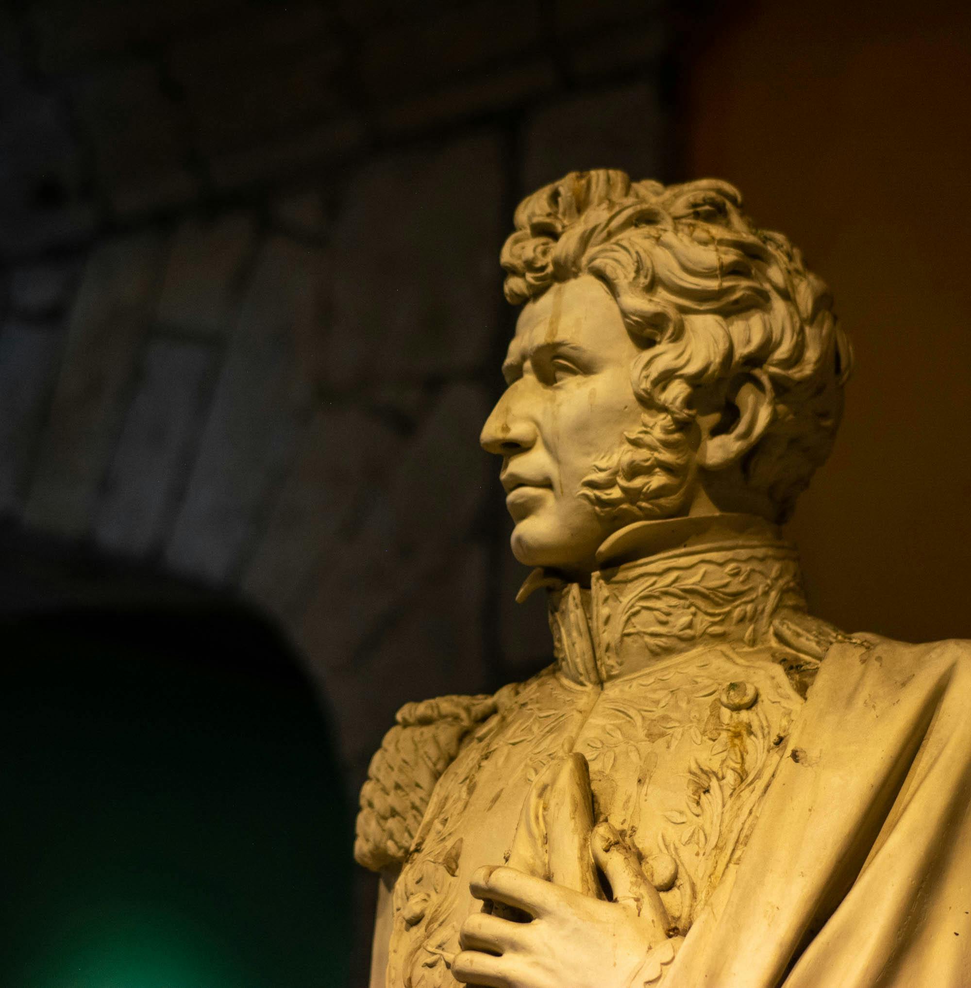 Historic Stone Statue in Museum Setting · Free Stock Photo