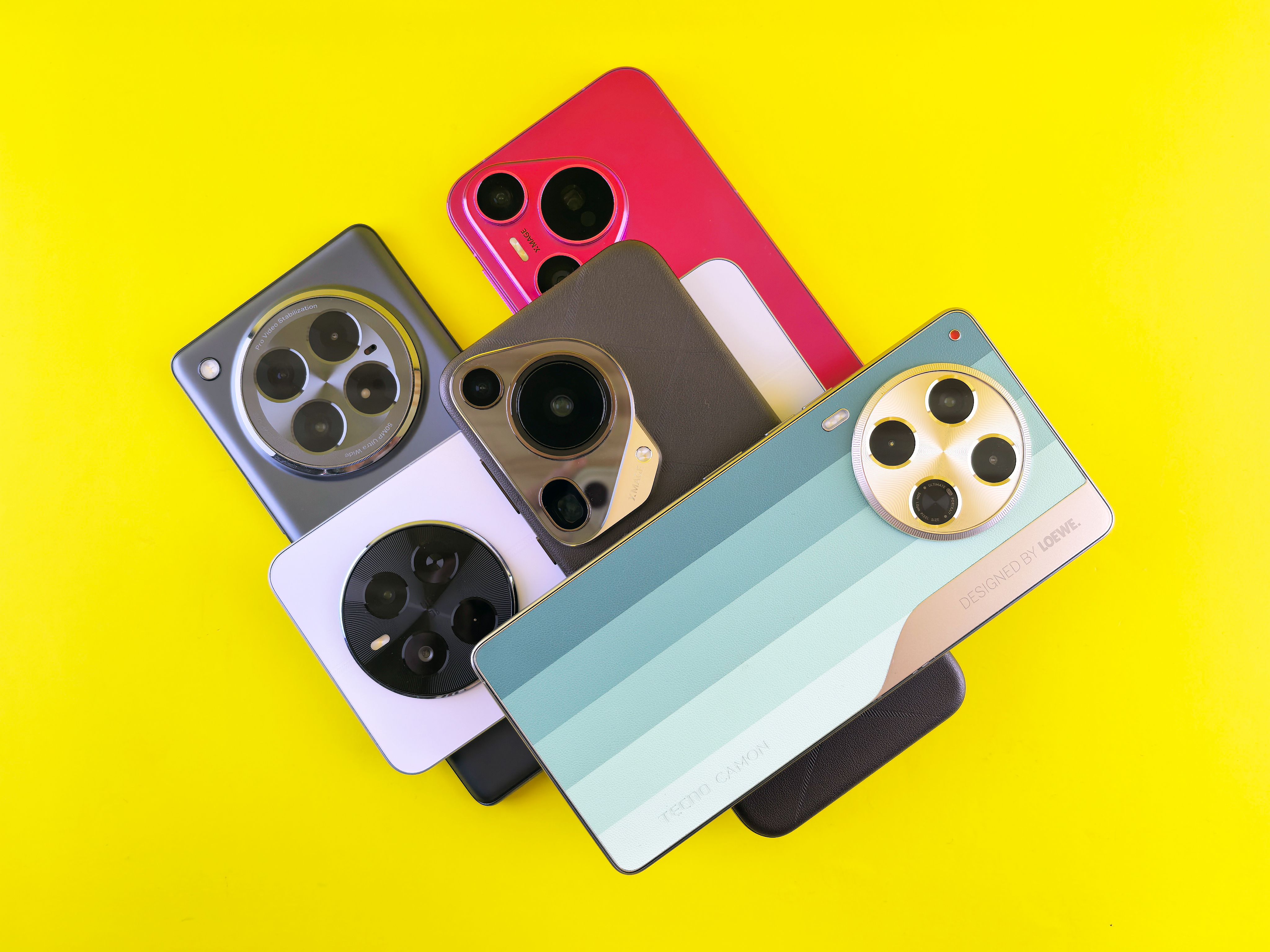 Colorful Smartphones on a Yellow Background · Free Stock Photo