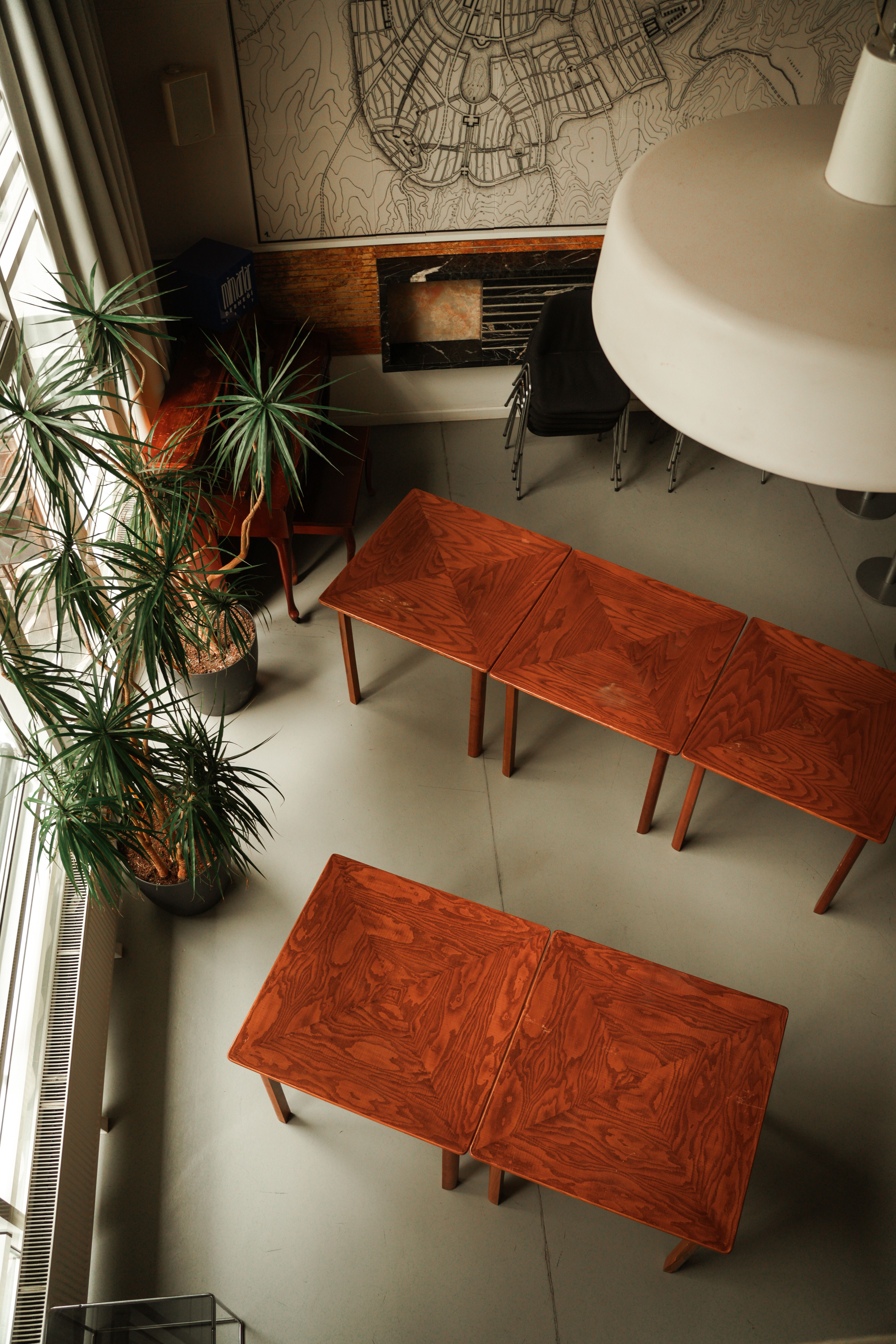 Aerial View of Modern Cafe Interior with Wooden Tables · Free Stock Photo