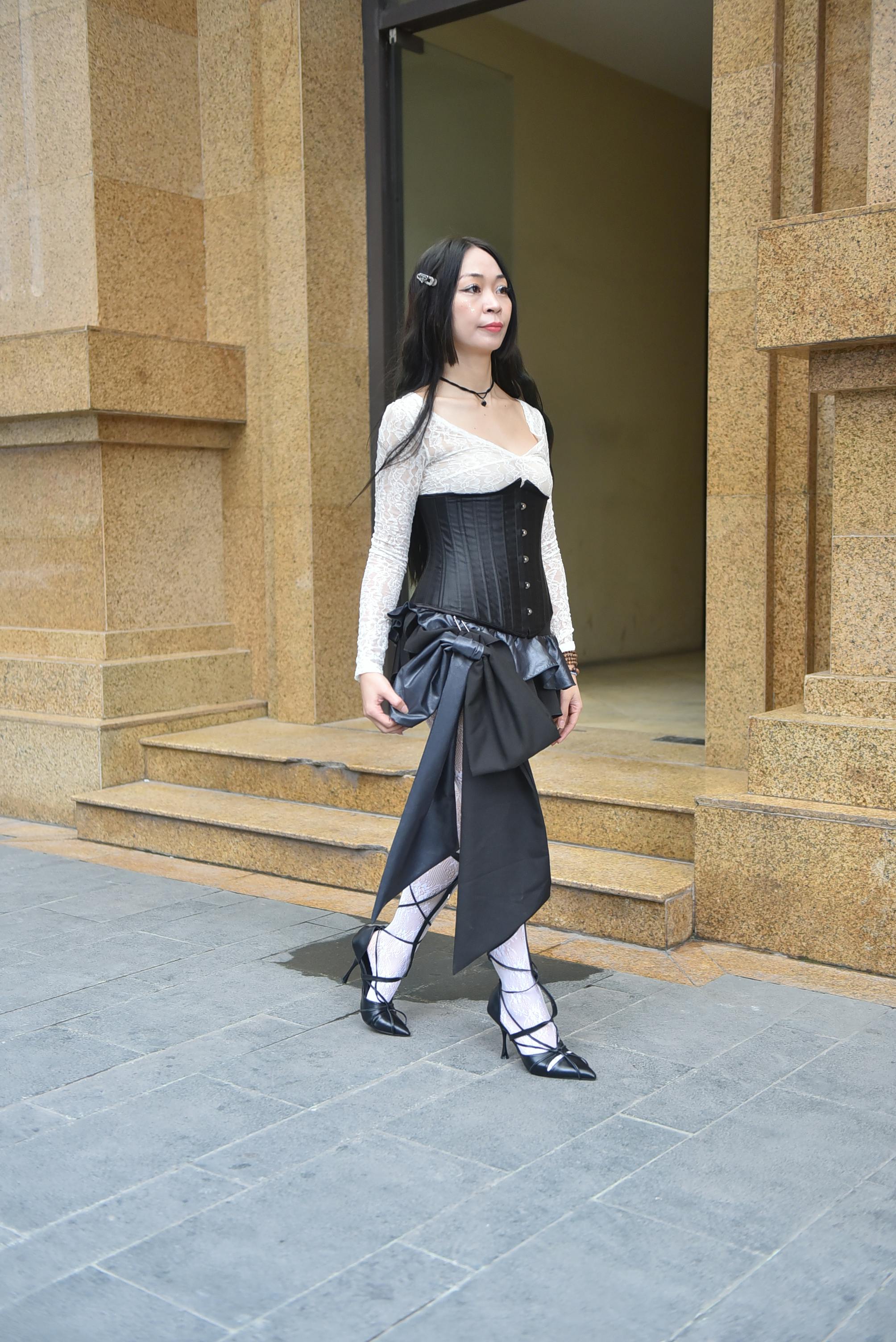 Gothic Fashion Walk in Urban Setting · Free Stock Photo