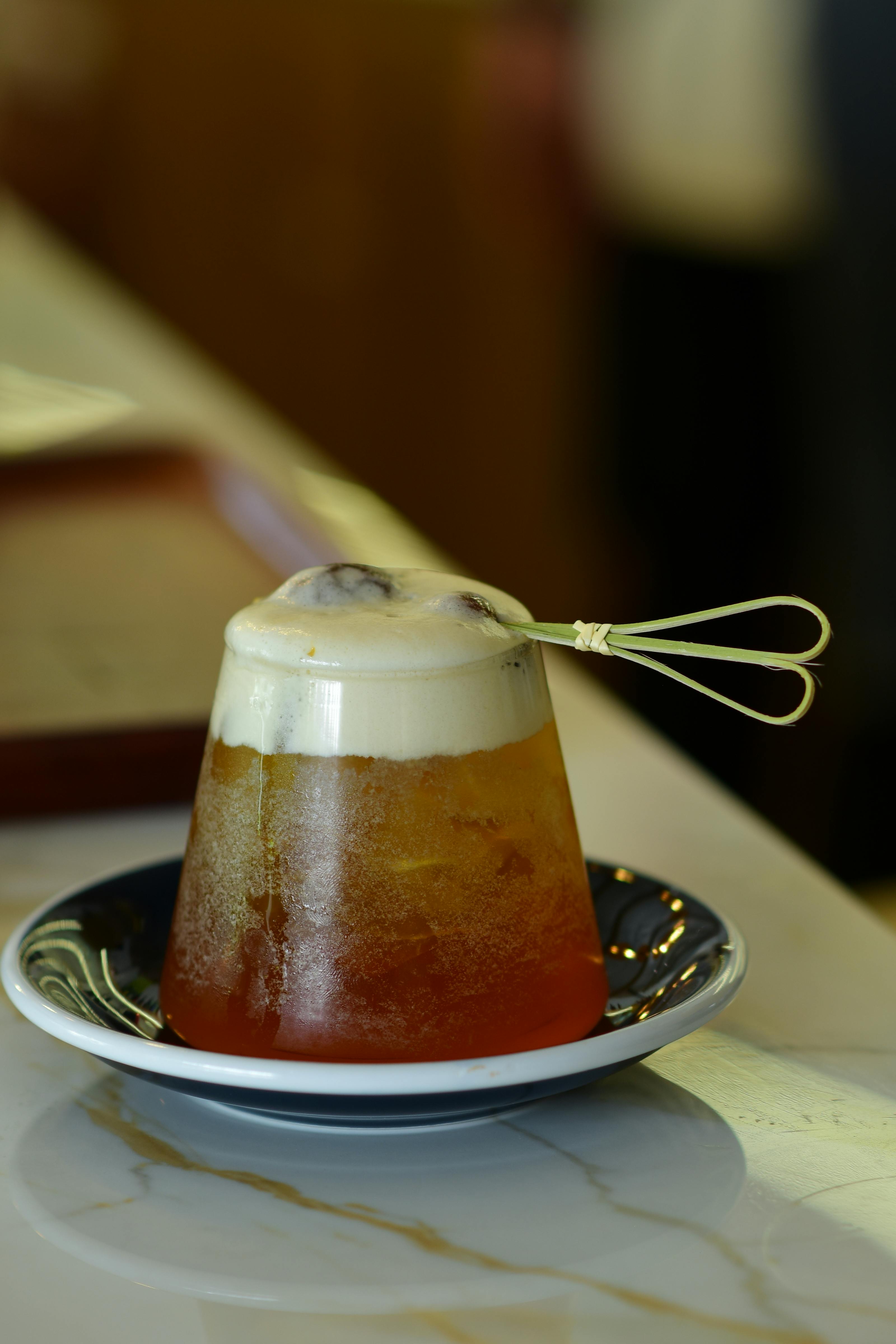 Refreshing Iced Tea With Foam and Garnish · Free Stock Photo