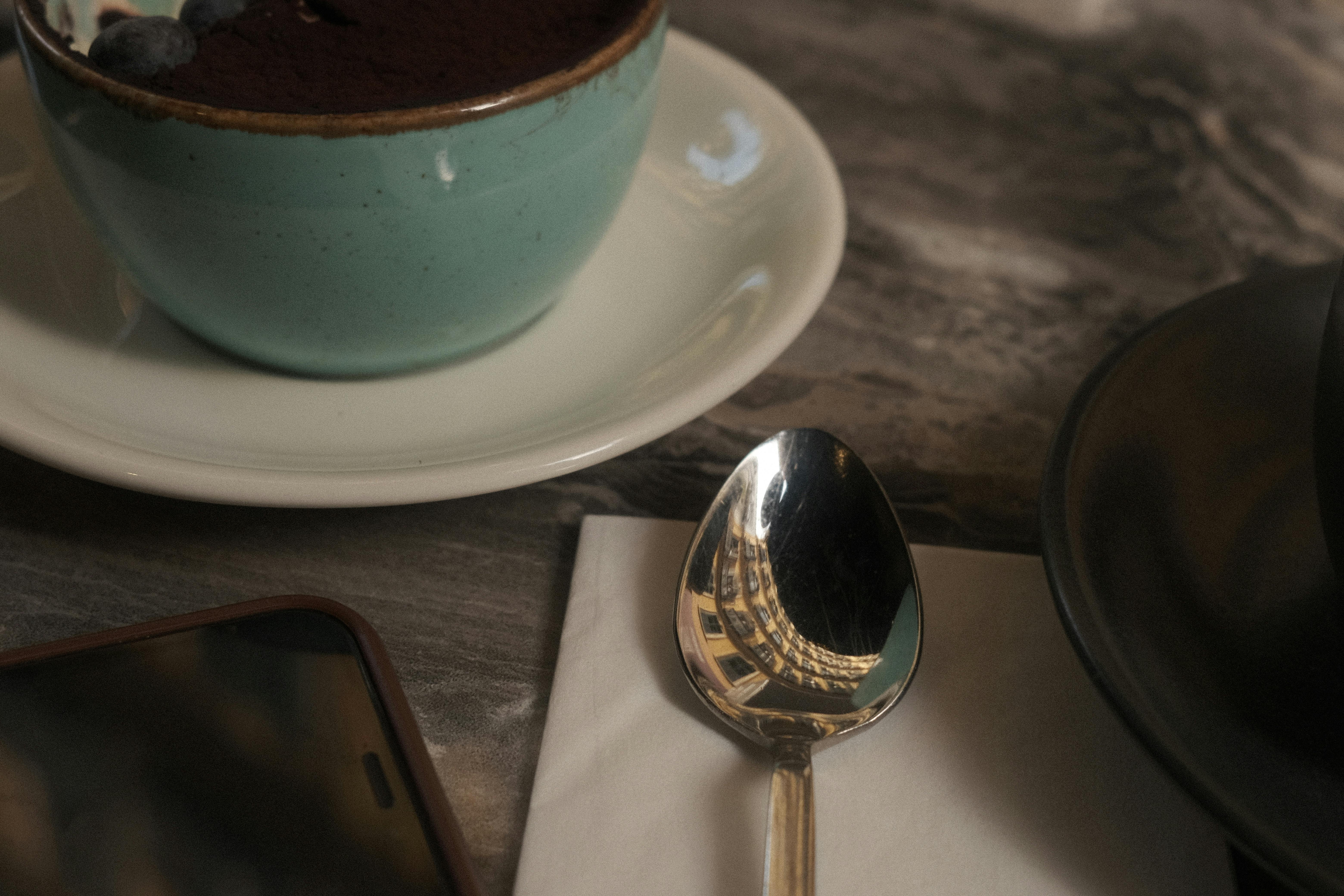 Artistic Reflection in Spoon at Café Table · Free Stock Photo