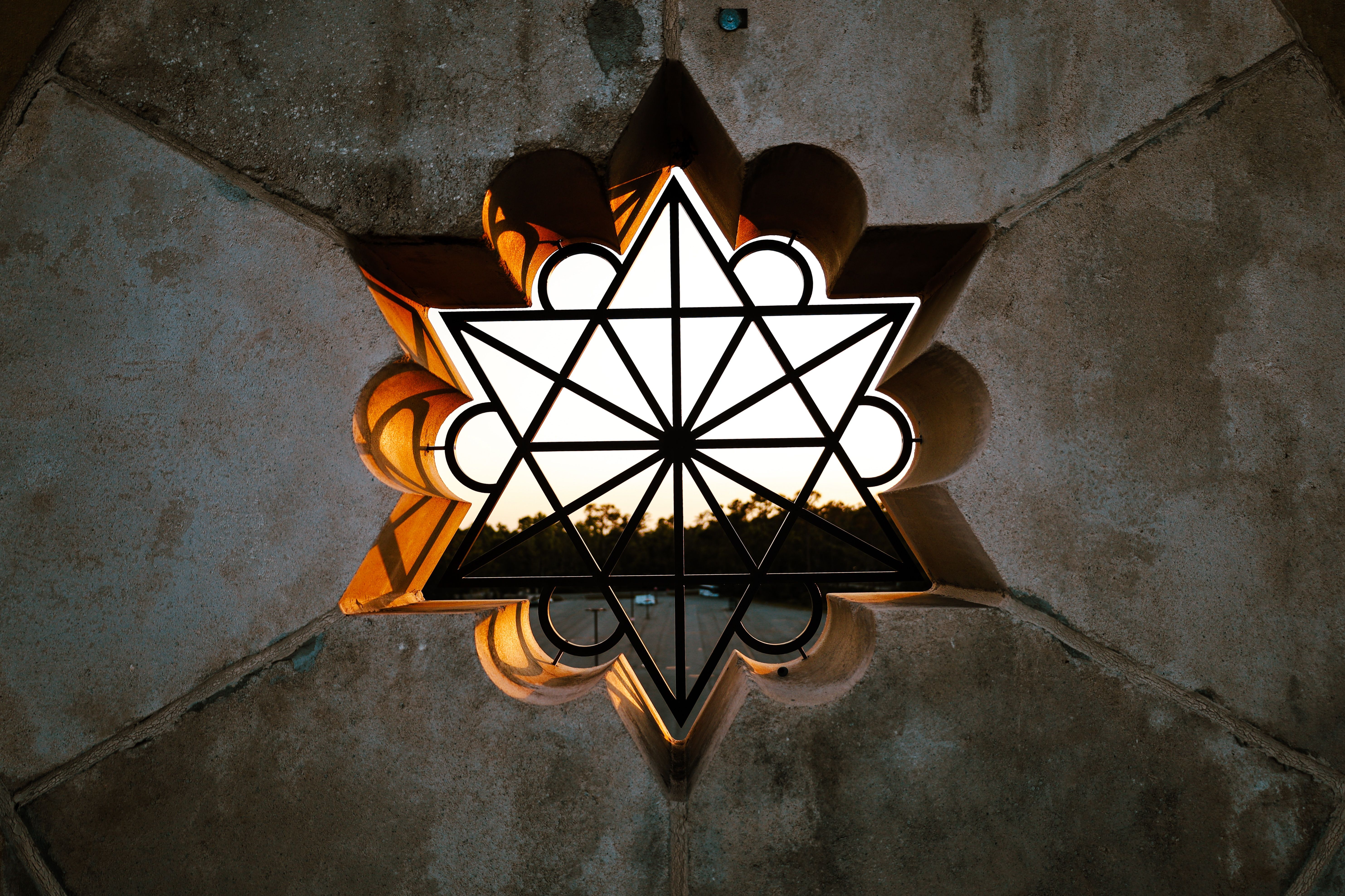 Geometric Star Window with Sunset Reflection · Free Stock Photo