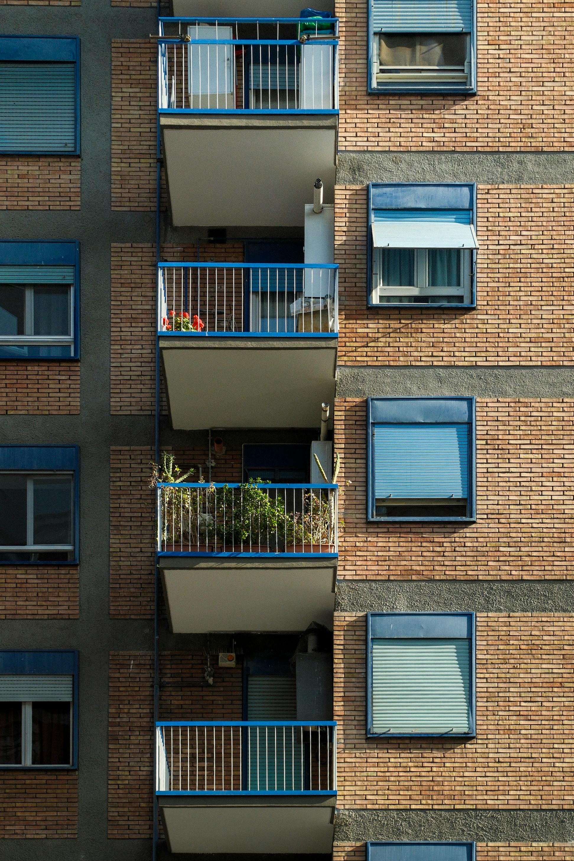 Modern Brick Apartment Building with Balconies · Free Stock Photo