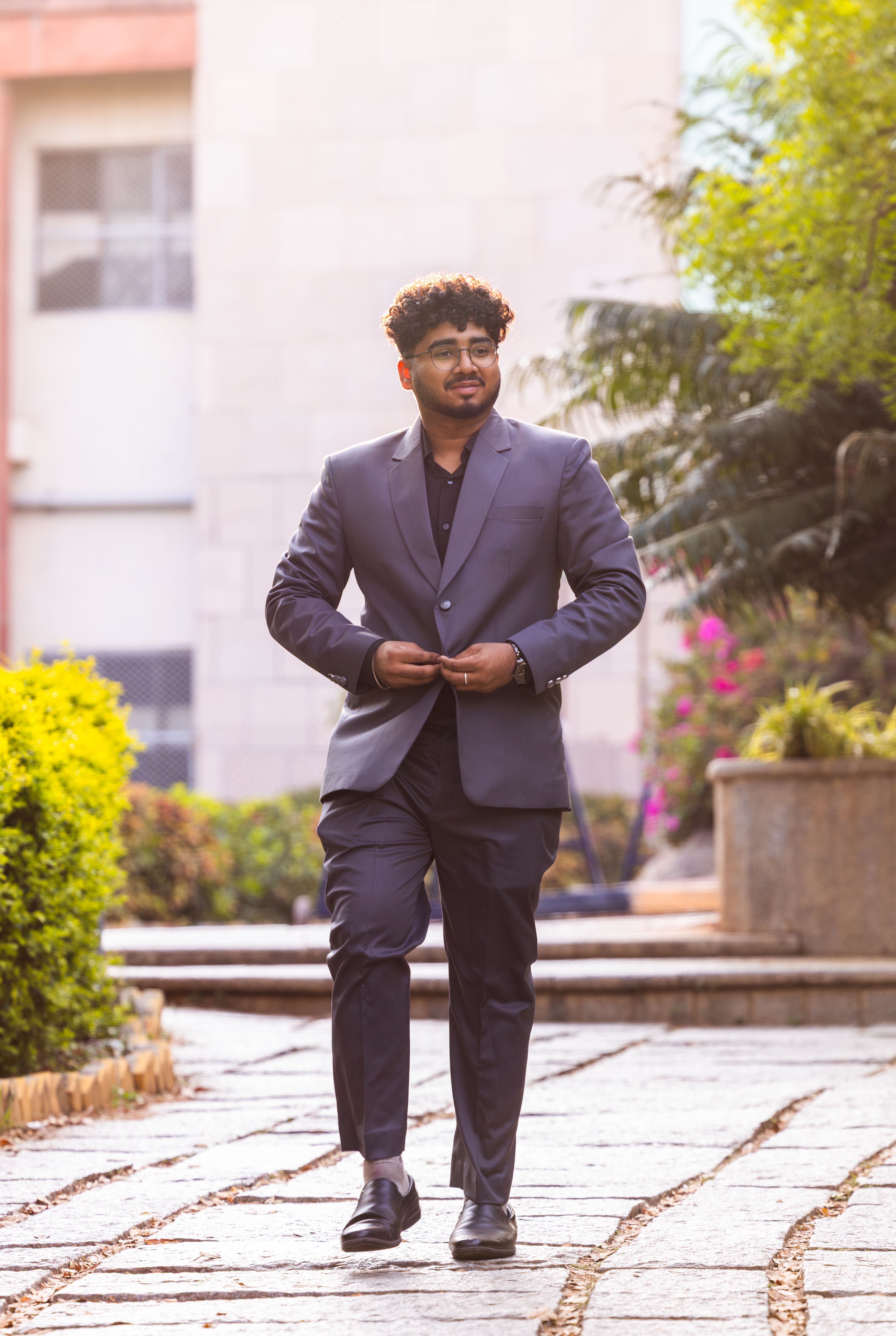 Confident Young Man in Stylish Suit Walking Outdoors · Free Stock Photo