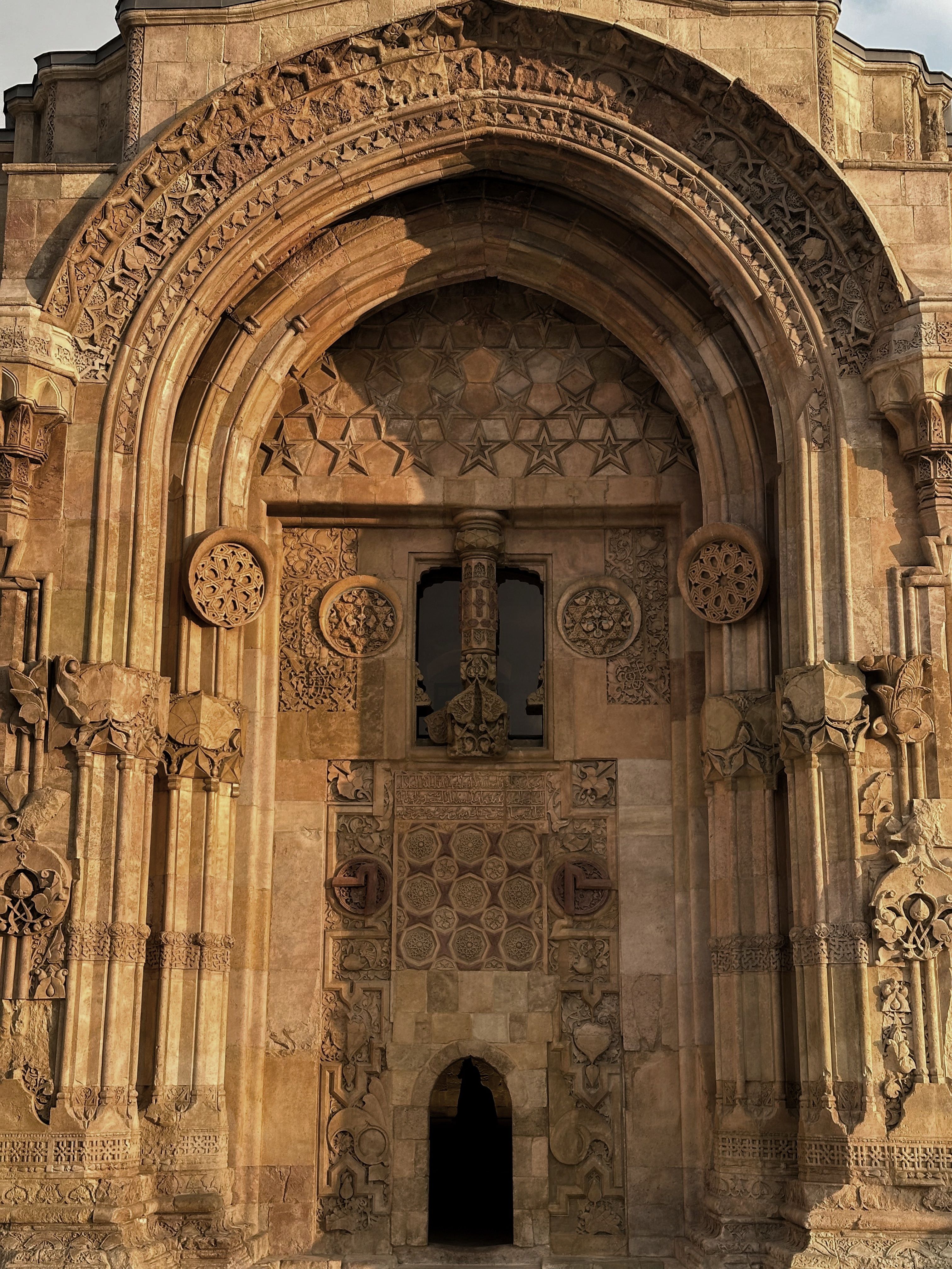 Intricate Ancient Stone Portal at Sunset · Free Stock Photo