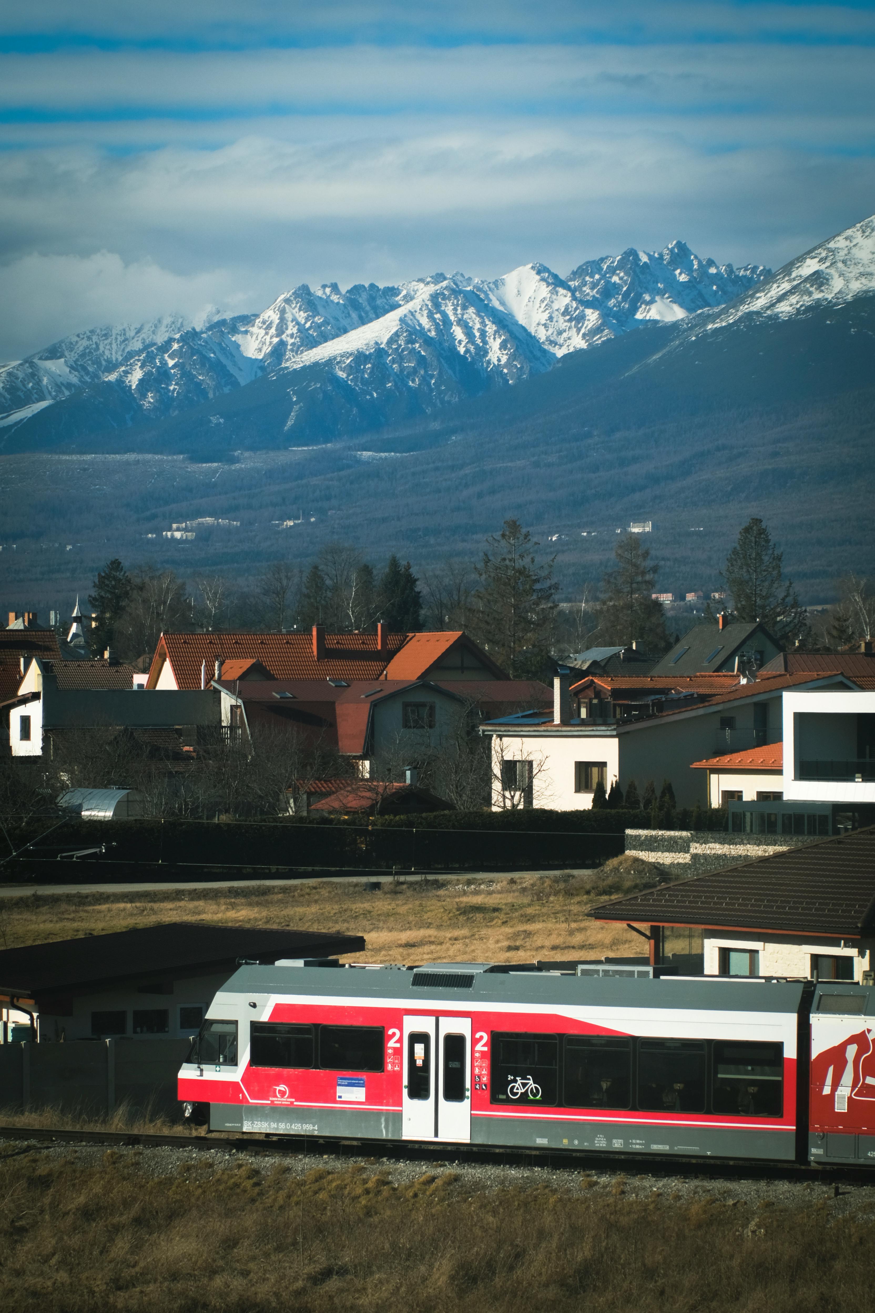 Modern Train Passing Through Tatra Mountains · Free Stock Photo
