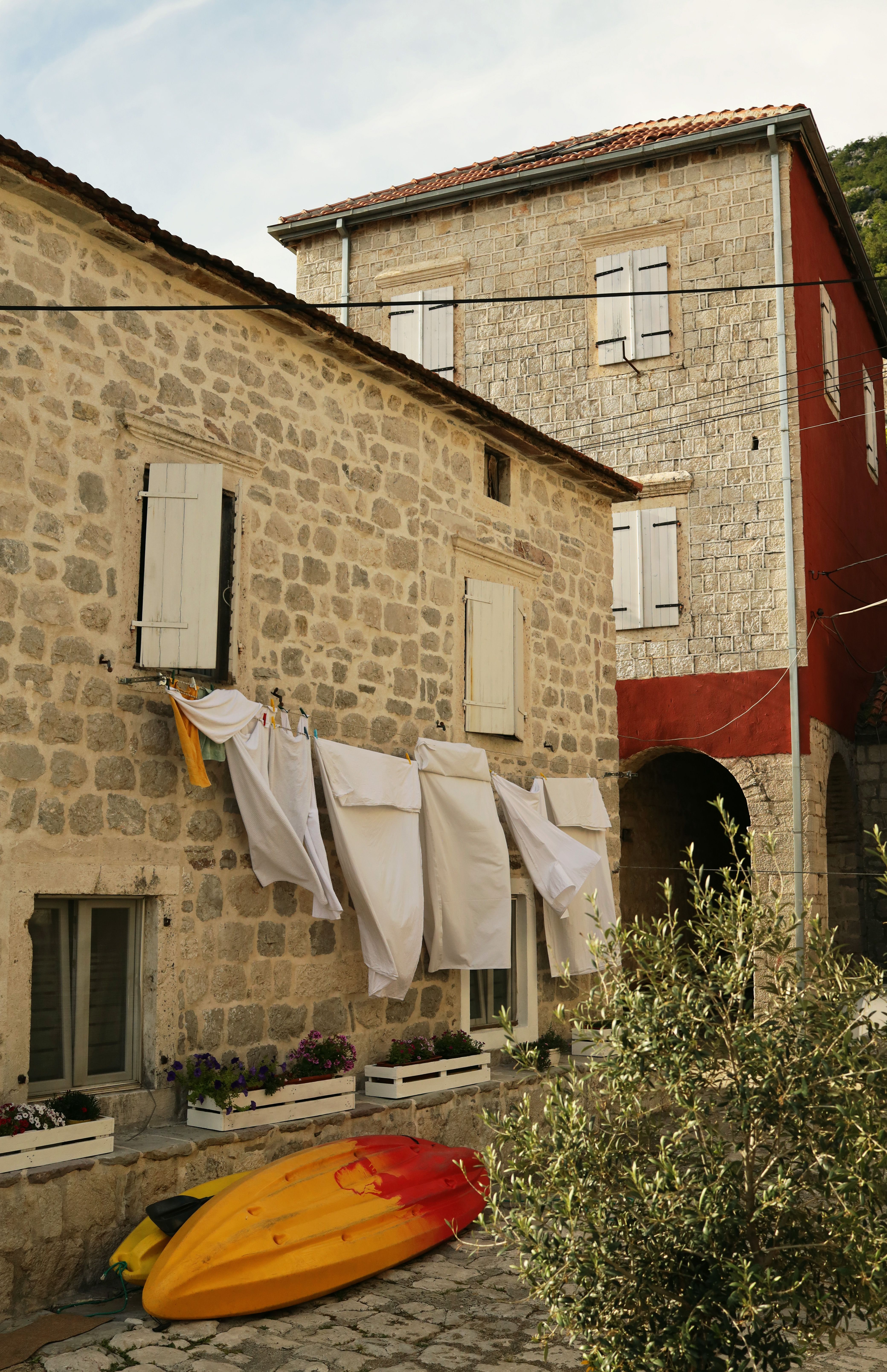 Rustic Stone House with Laundry on Mediterranean Coast · Free Stock Photo