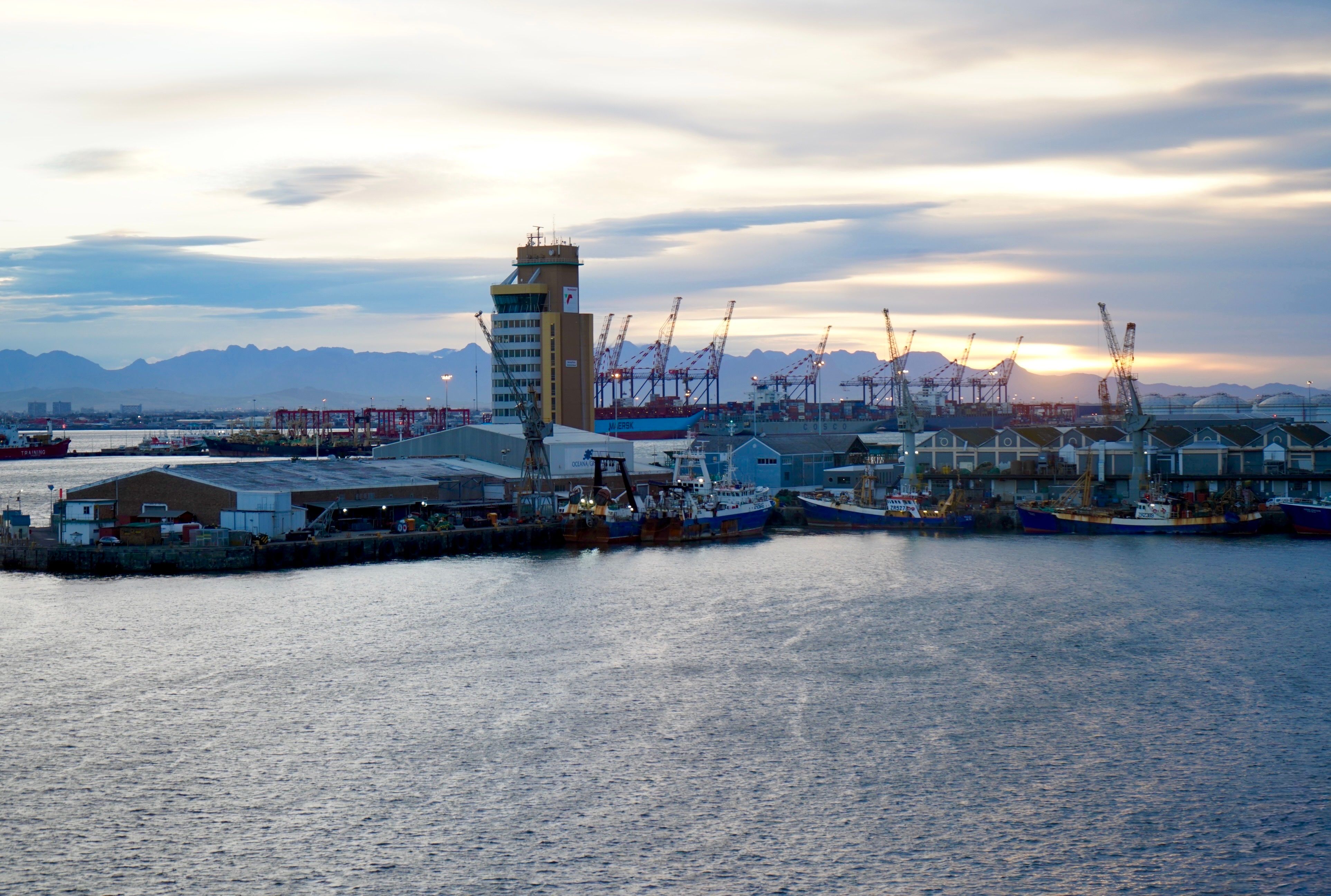 Scenic Port View with Cranes at Sunset · Free Stock Photo