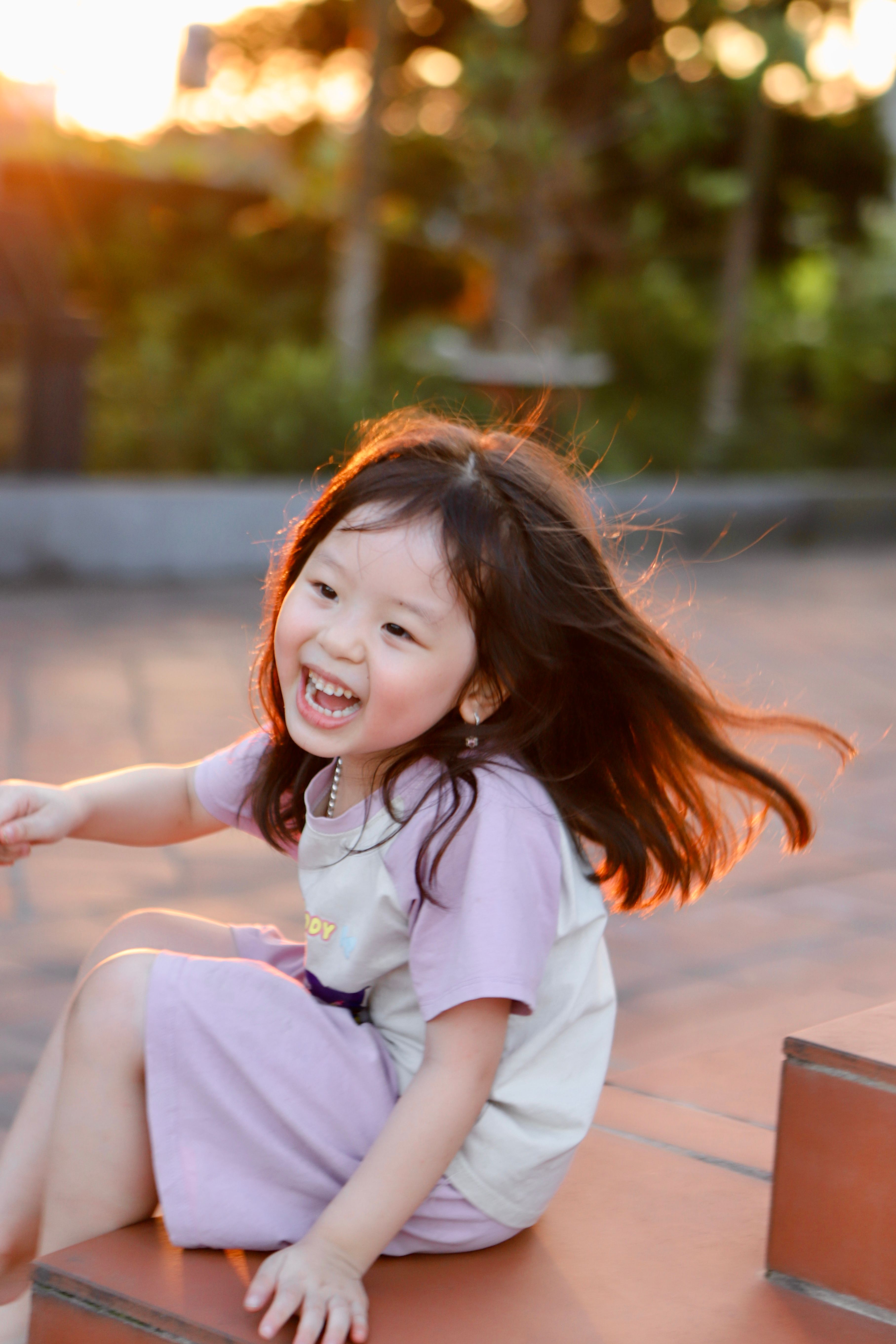 Joyful Vietnamese Child Playing at Sunset · Free Stock Photo