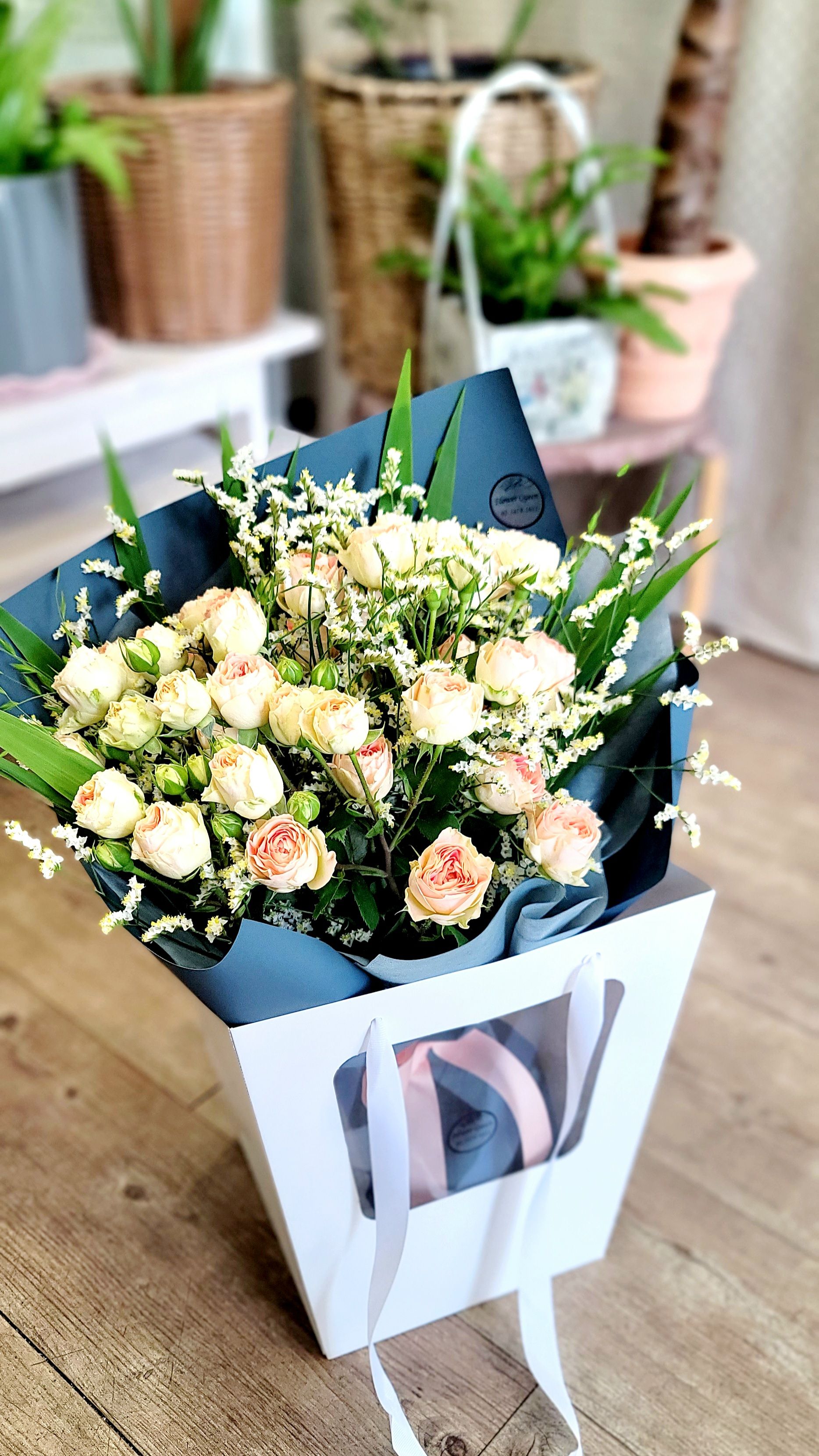 Elegant Flower Bouquet in Stylish Packaging · Free Stock Photo