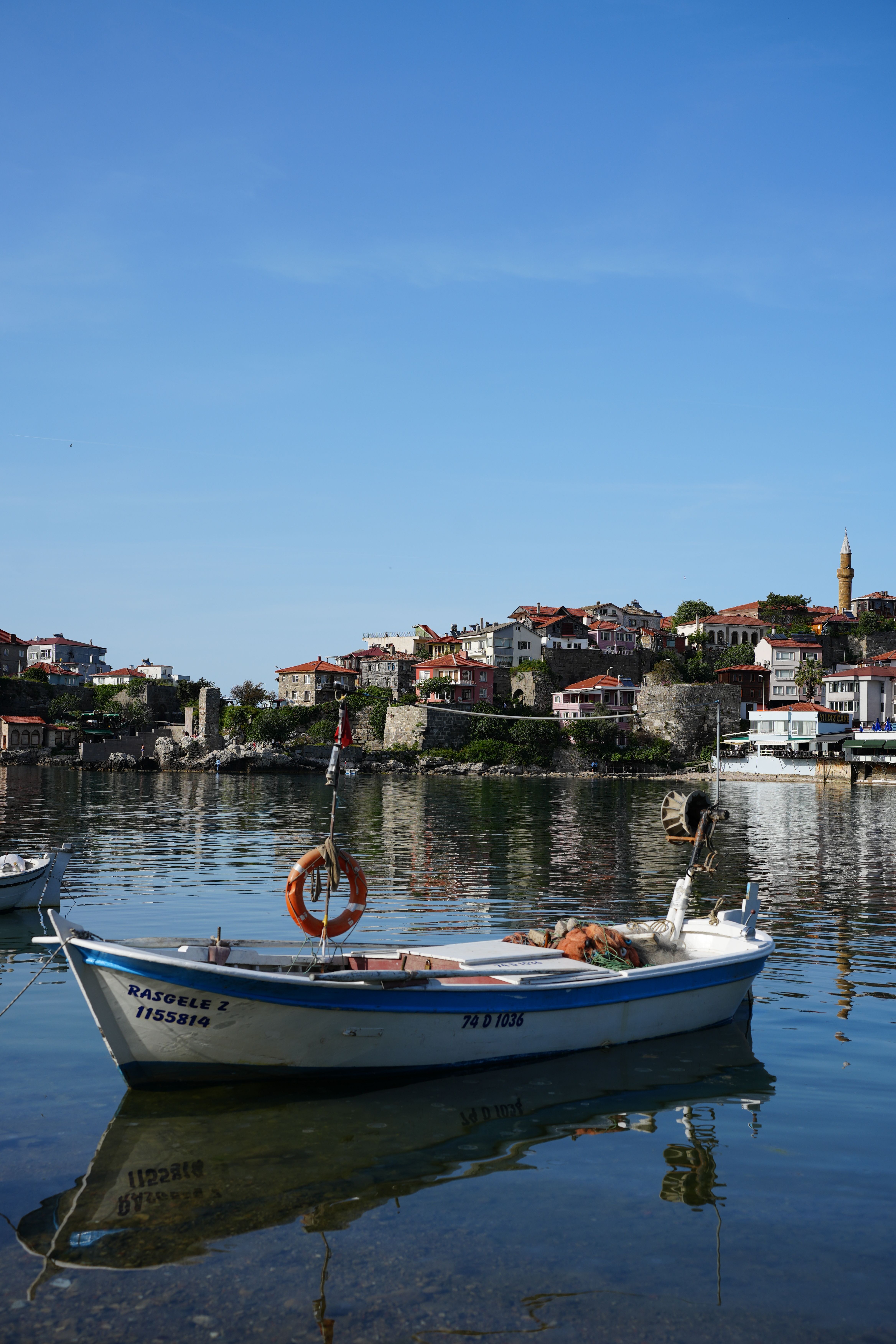 Scenic View of Fishing Boat in Quaint Harbor · Free Stock Photo