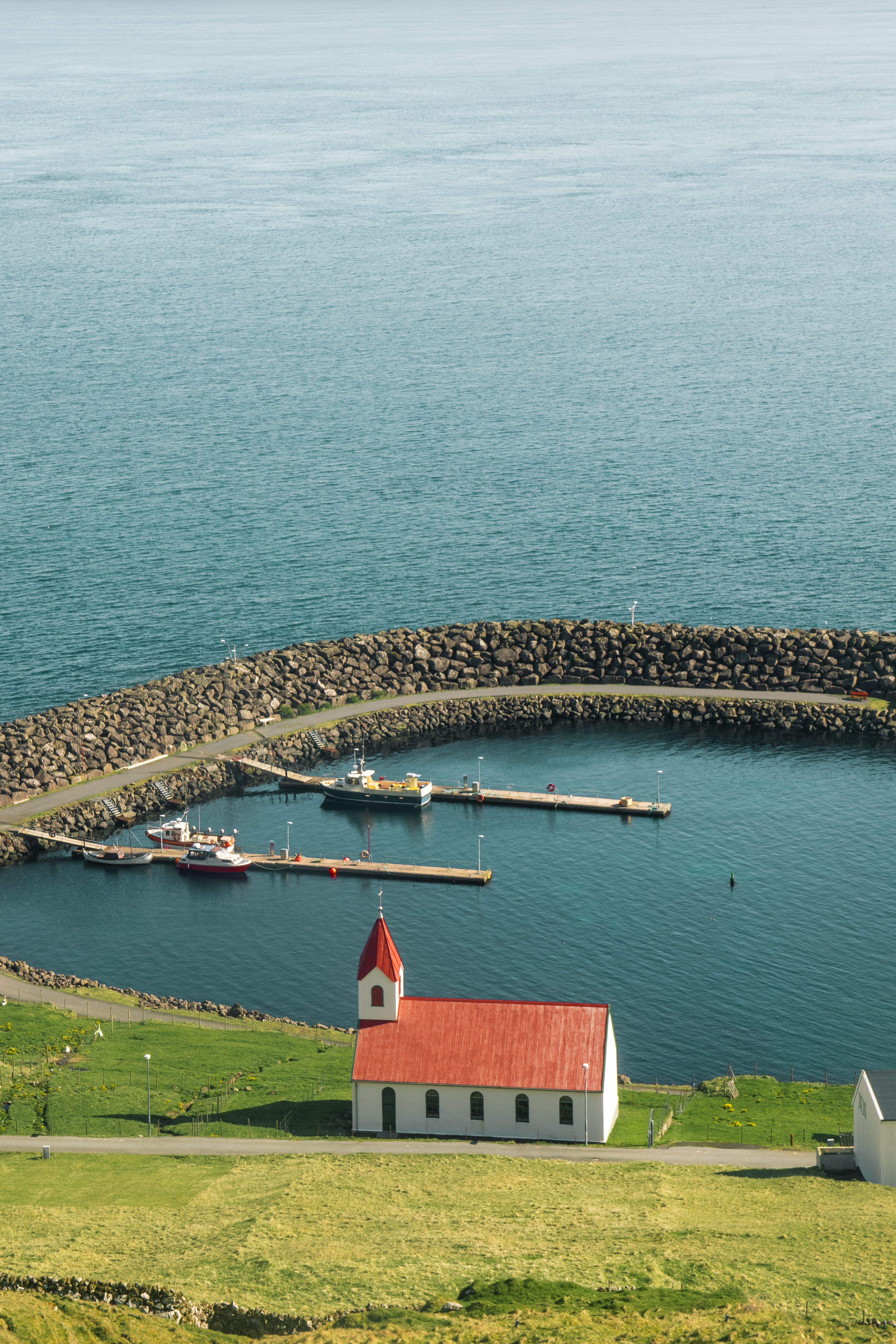 Scenic Coastal Church Overlooking the Harbor · Free Stock Photo