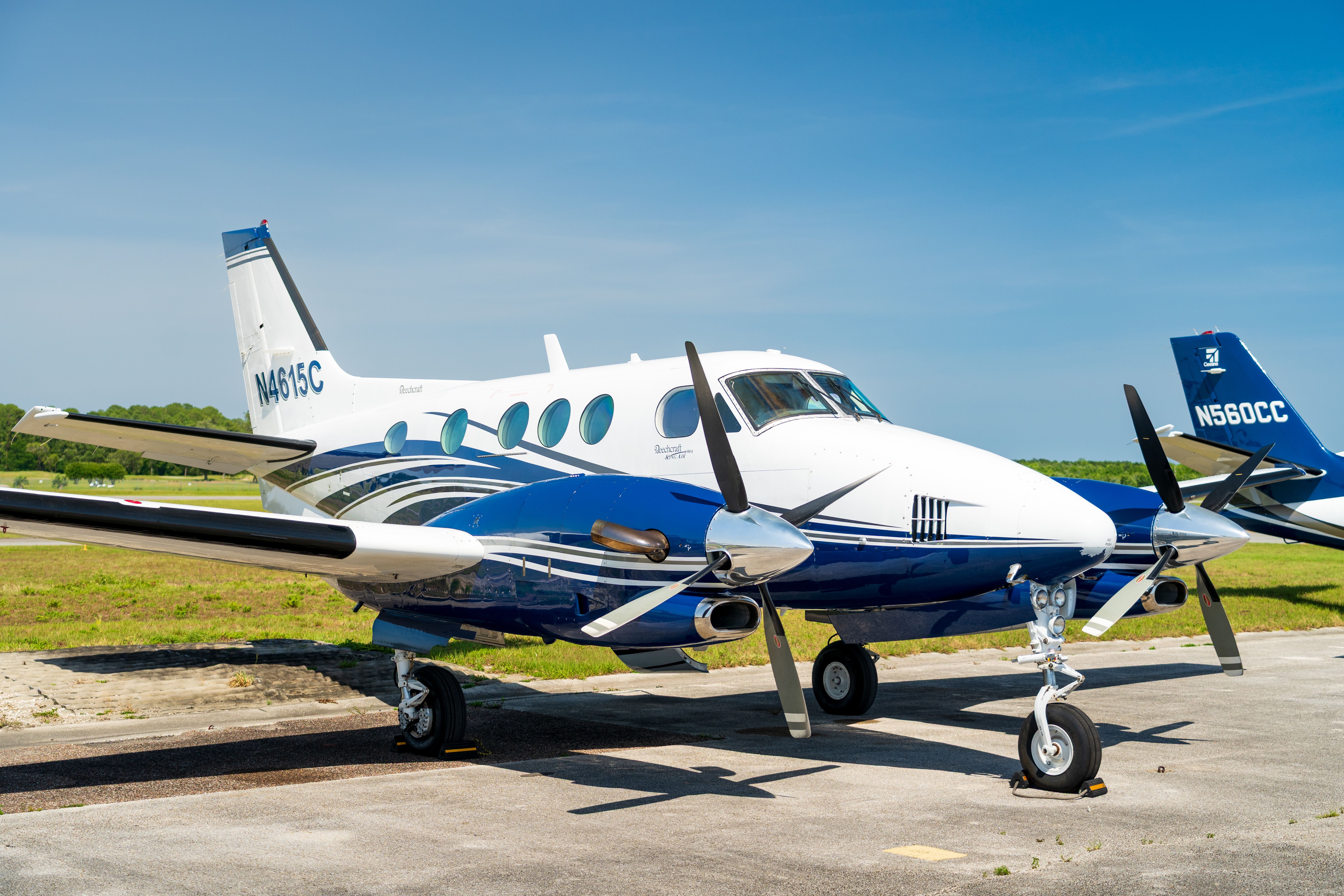 Small Blue and White Private Aircraft on Runway · Free Stock Photo