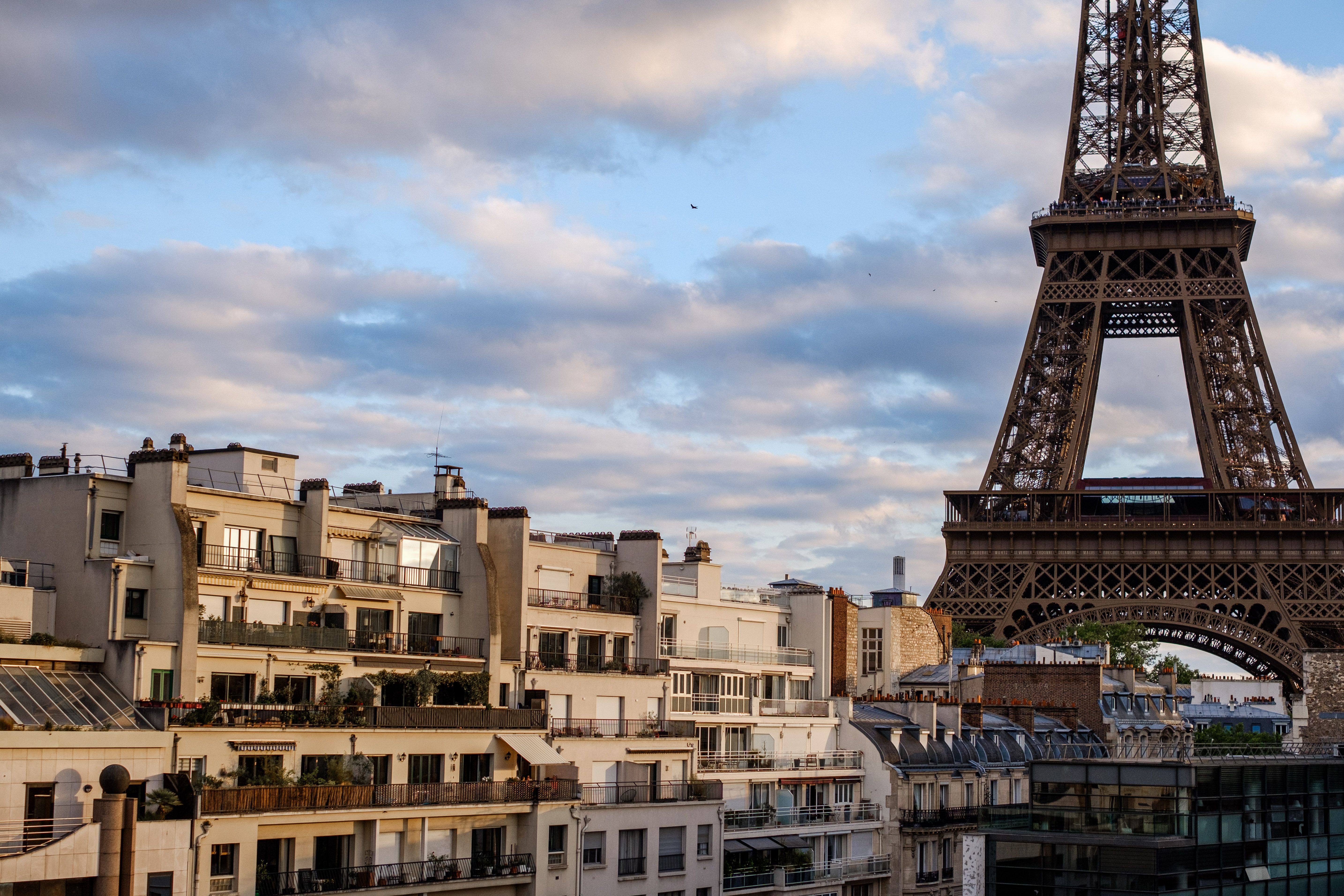 Eiffel Tower with Parisian Apartments at Sunset · Free Stock Photo