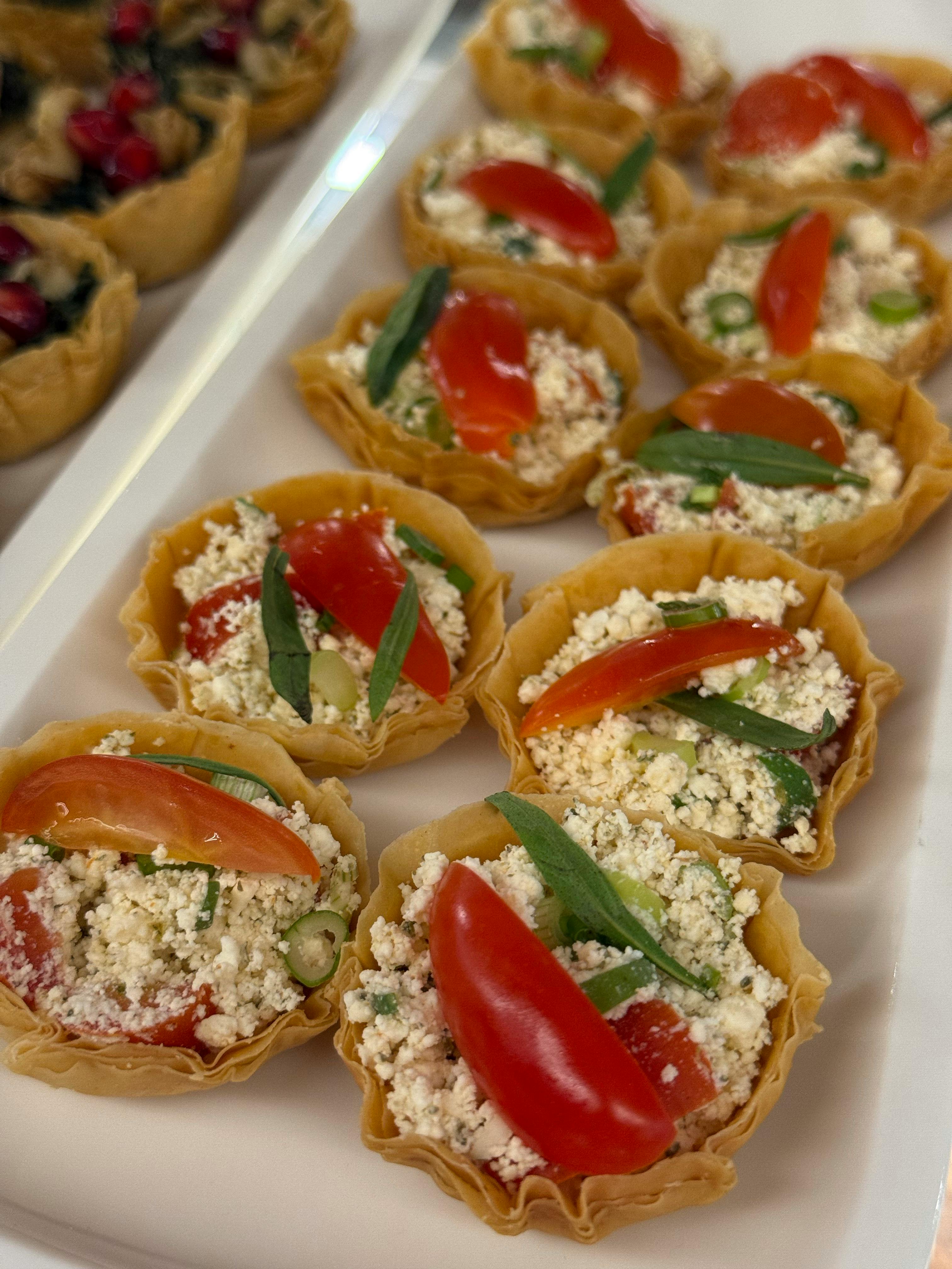 Close-up of Fresh Tomato and Cheese Tartlets · Free Stock Photo