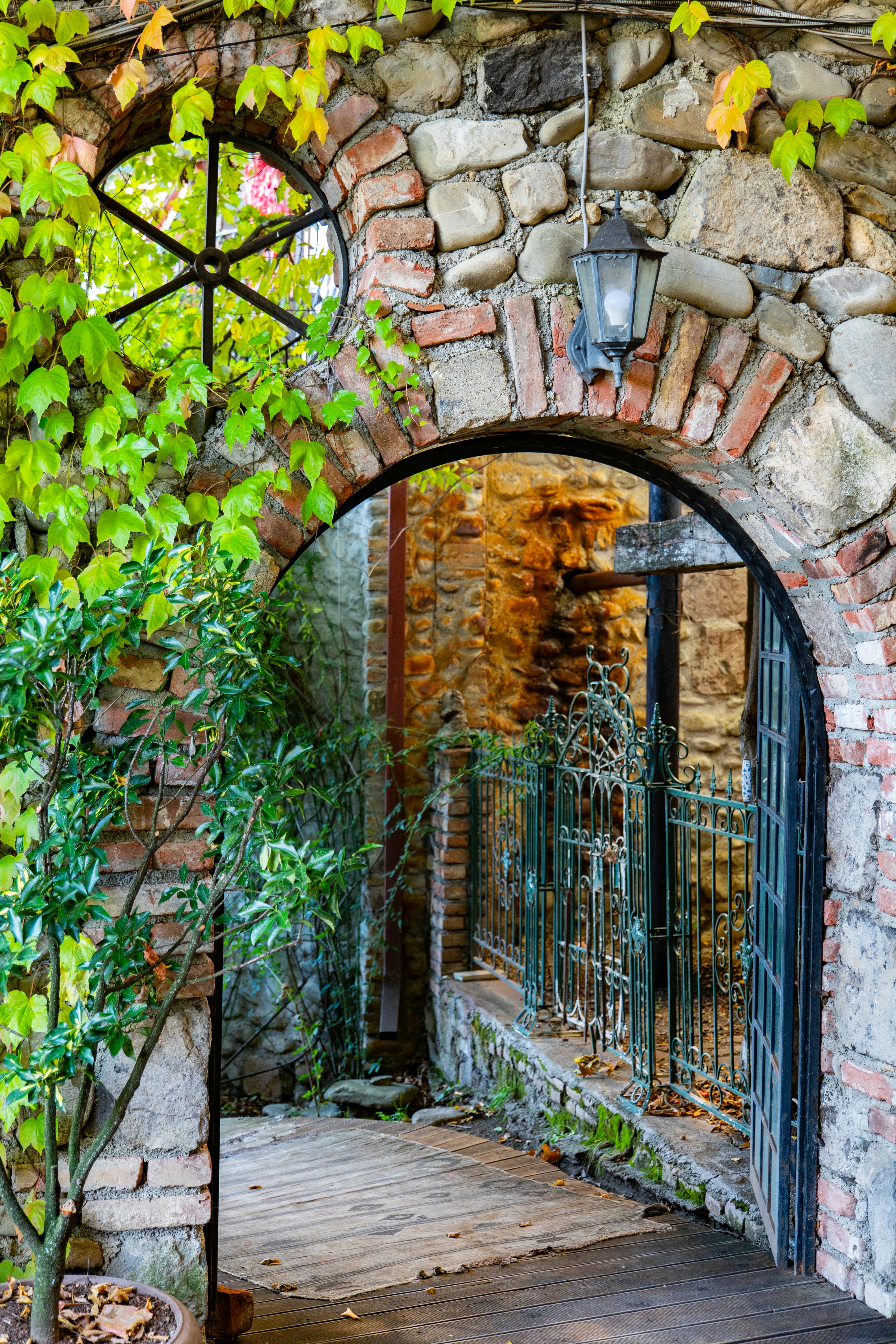 Charming Stone Archway with Ivy in Telavi, Georgia · Free Stock Photo