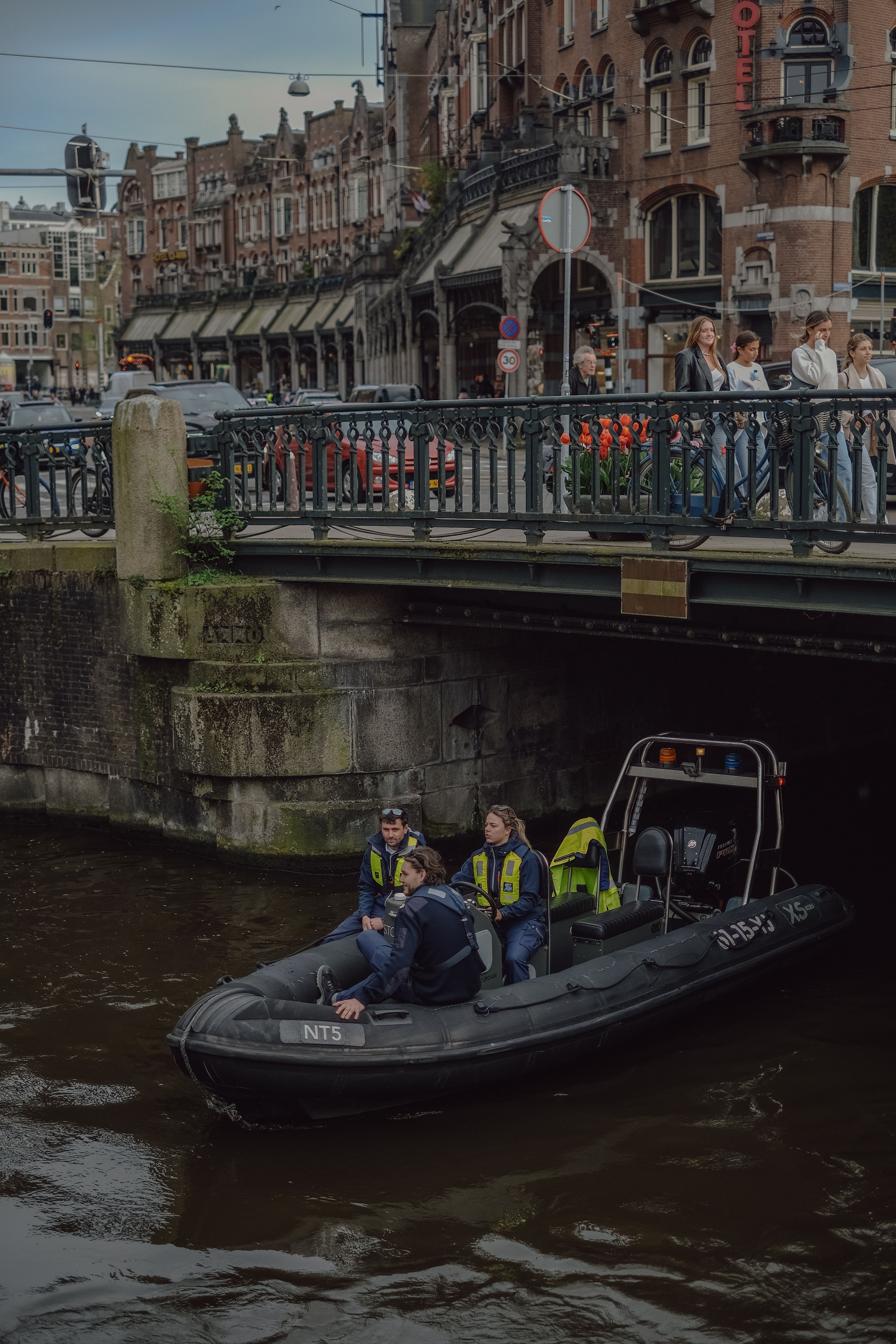 City Canal with Boat Under Bridge in Amsterdam · Free Stock Photo