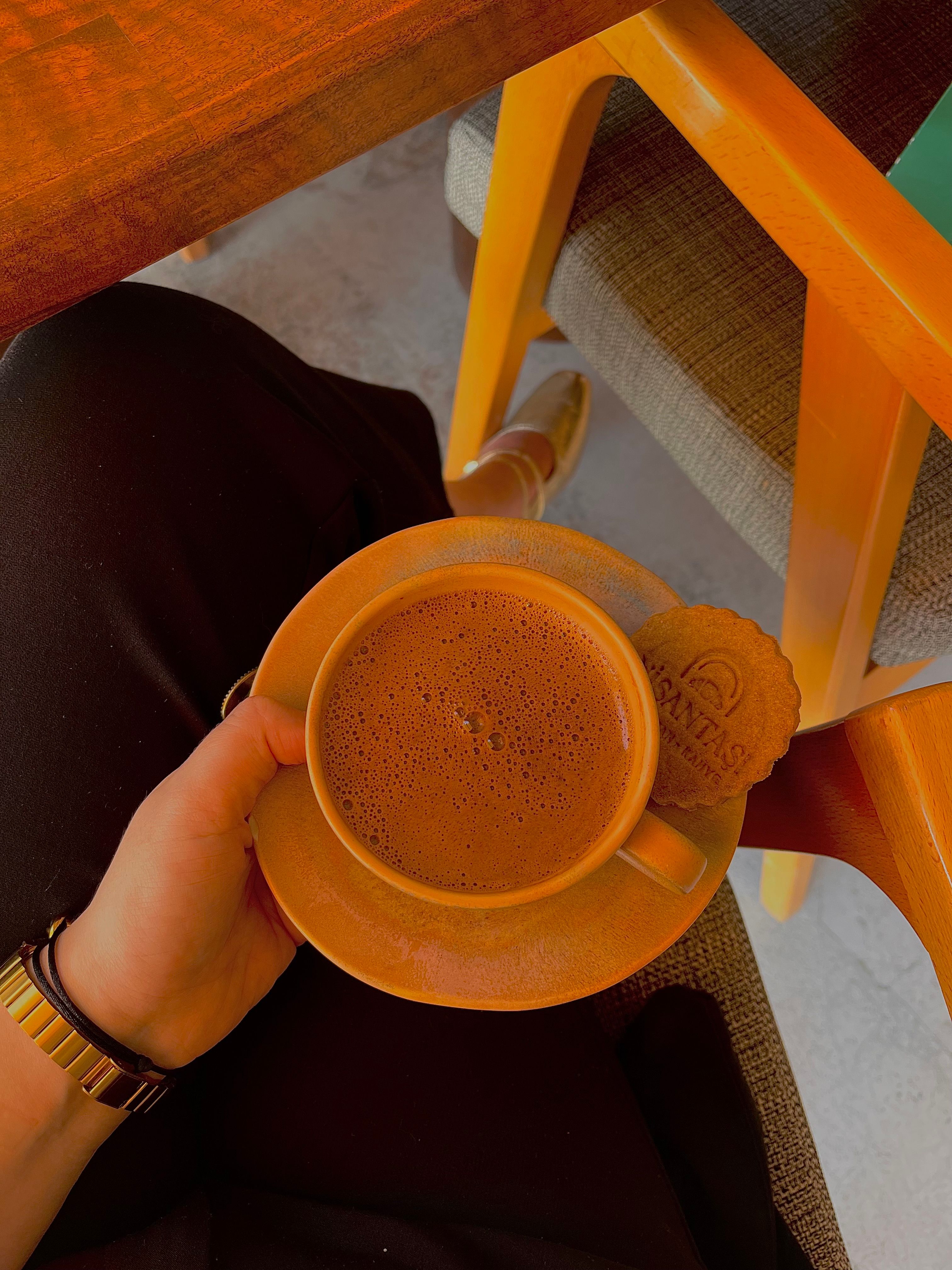 Cozy Coffee Moment in Wooden Cafe Setting · Free Stock Photo