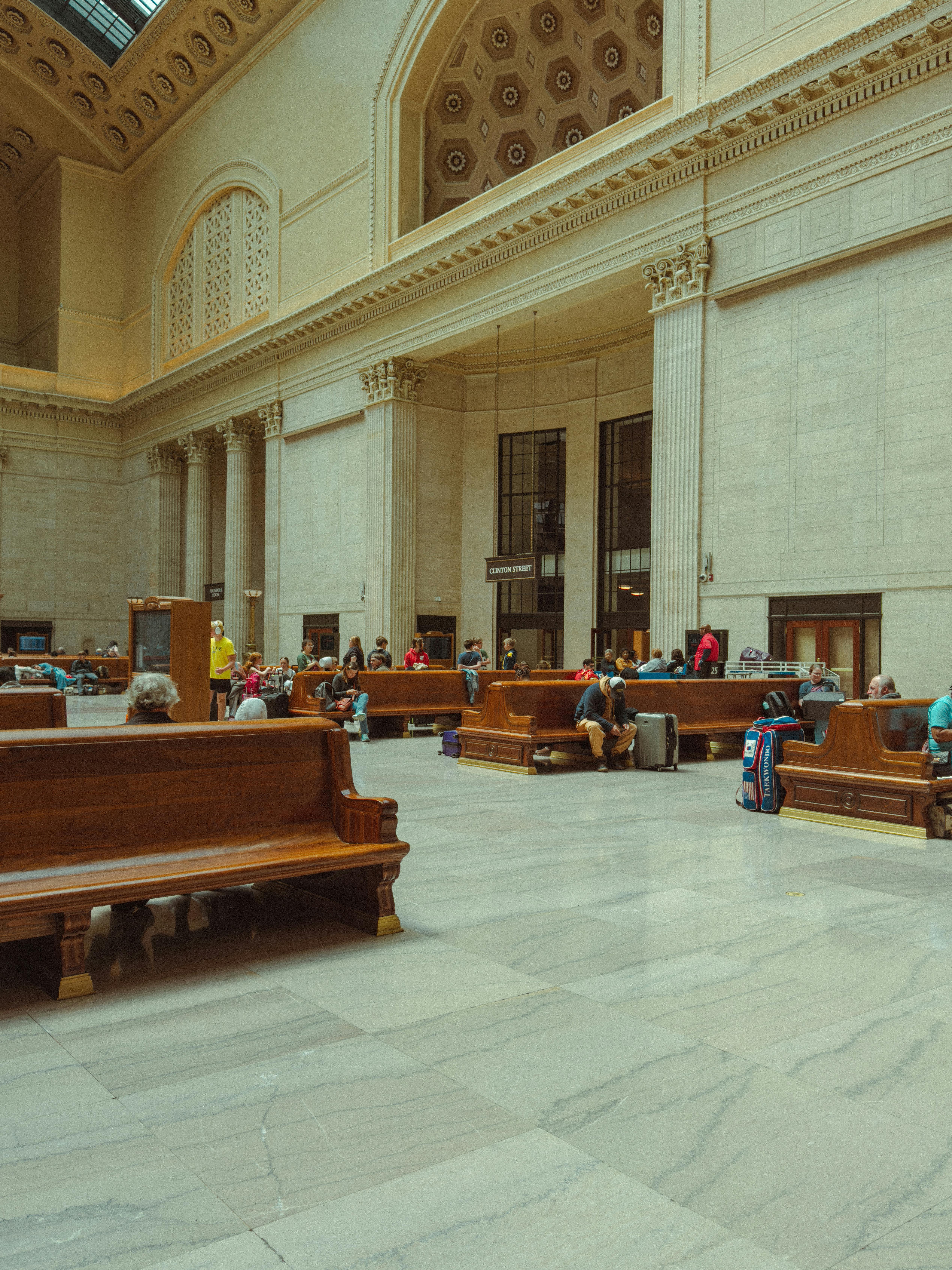 Historic Grand Hall with Wooden Benches · Free Stock Photo