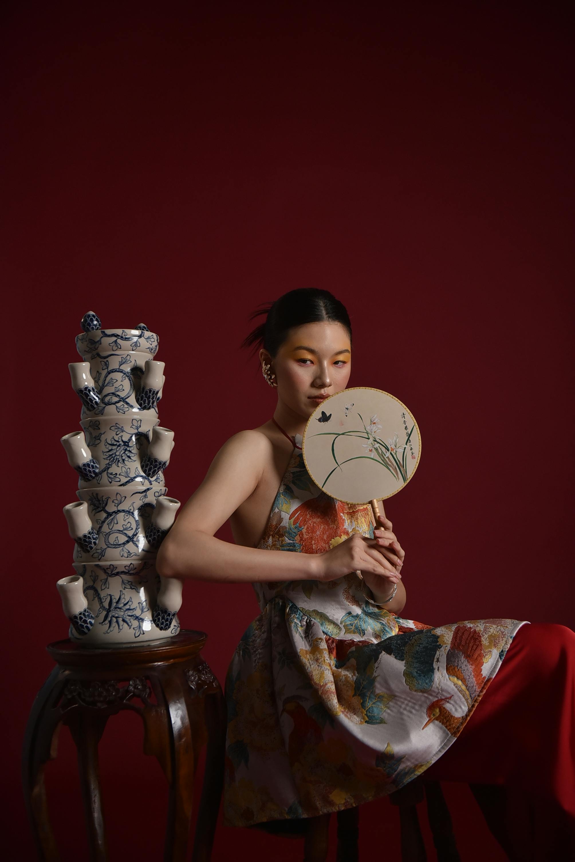 Elegant Portrait with Traditional Fan and Porcelain · Free Stock Photo
