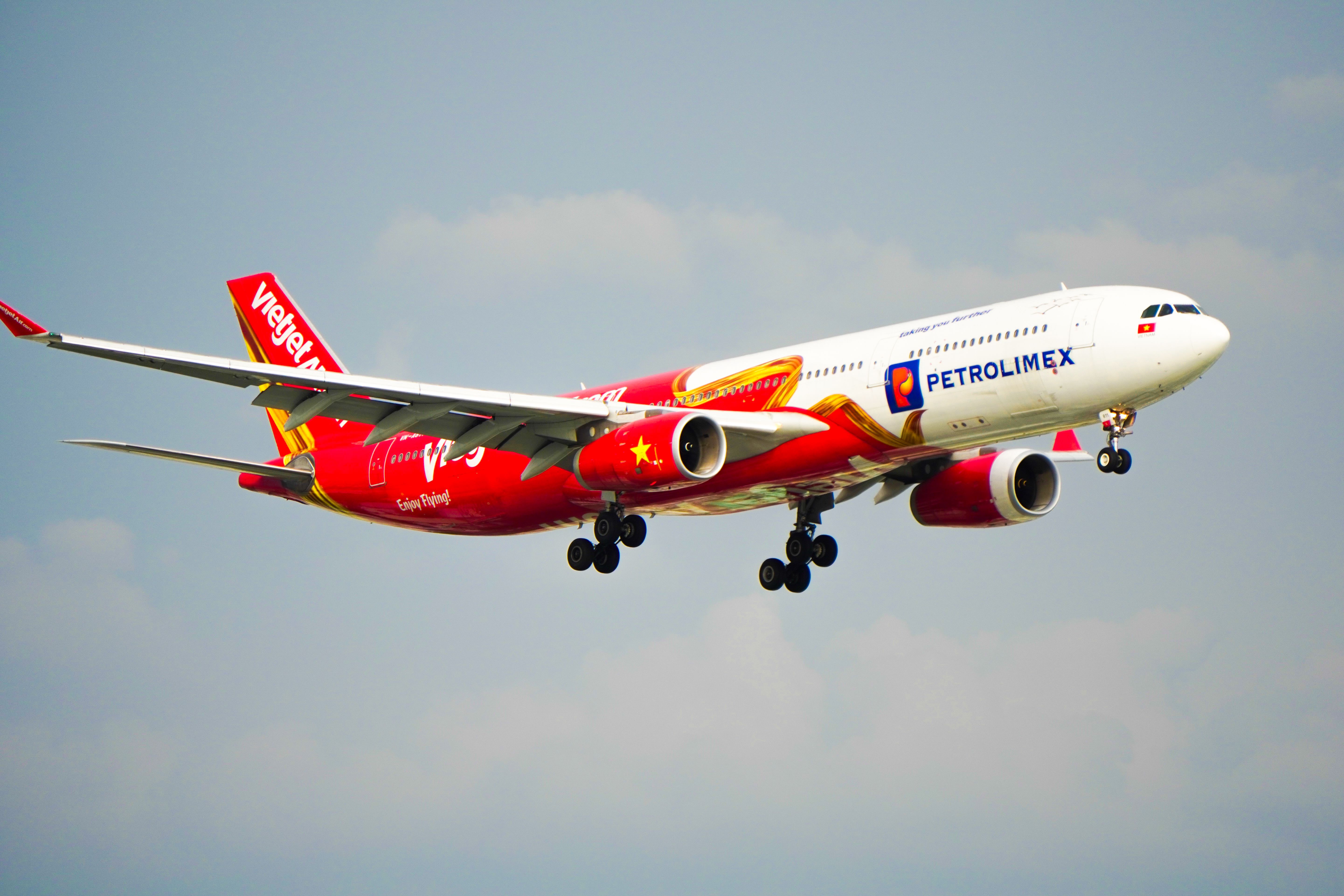 Vibrant Airbus A330 in Flight with Branding · Free Stock Photo