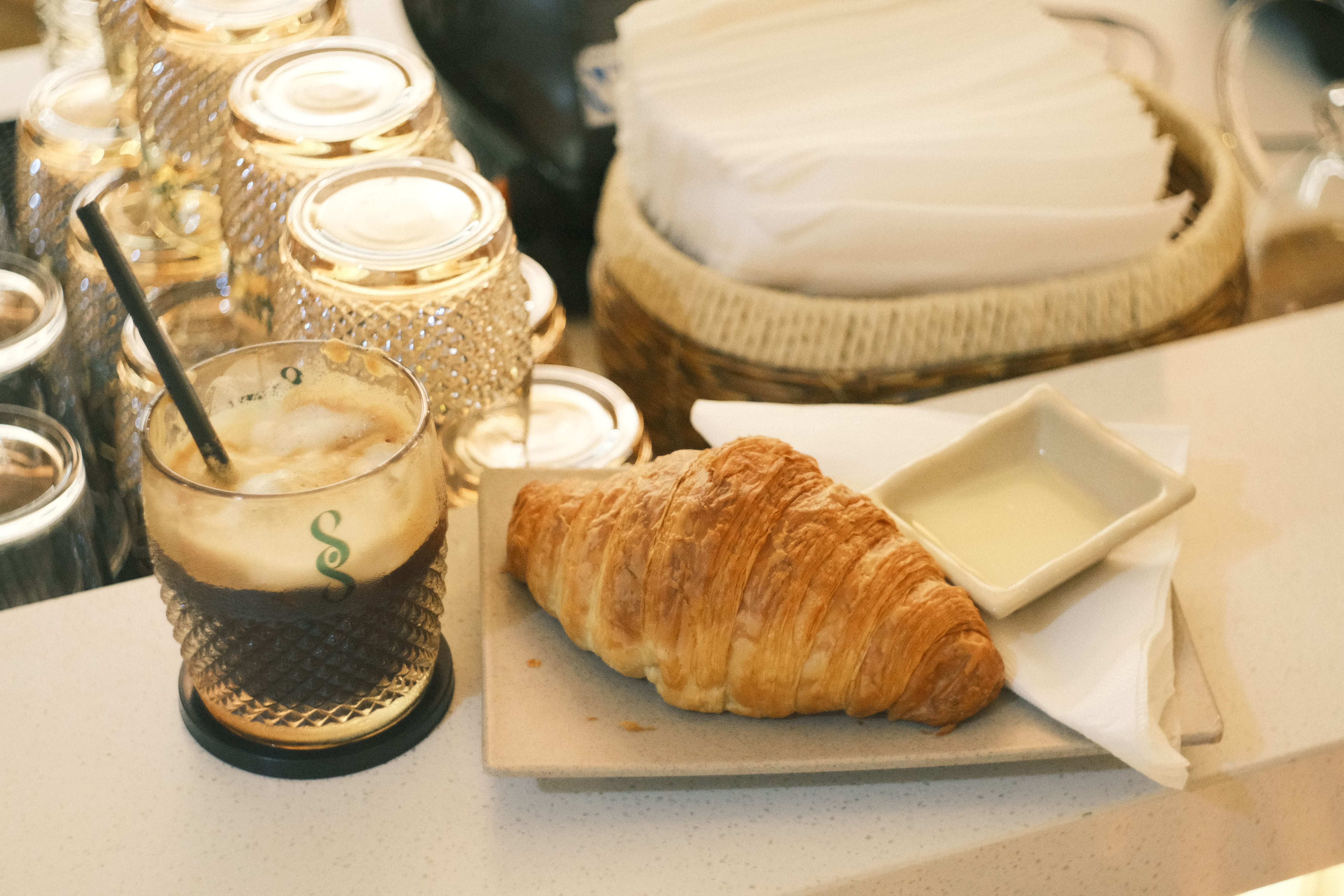 Croissant and Iced Coffee on a Cafe Counter · Free Stock Photo