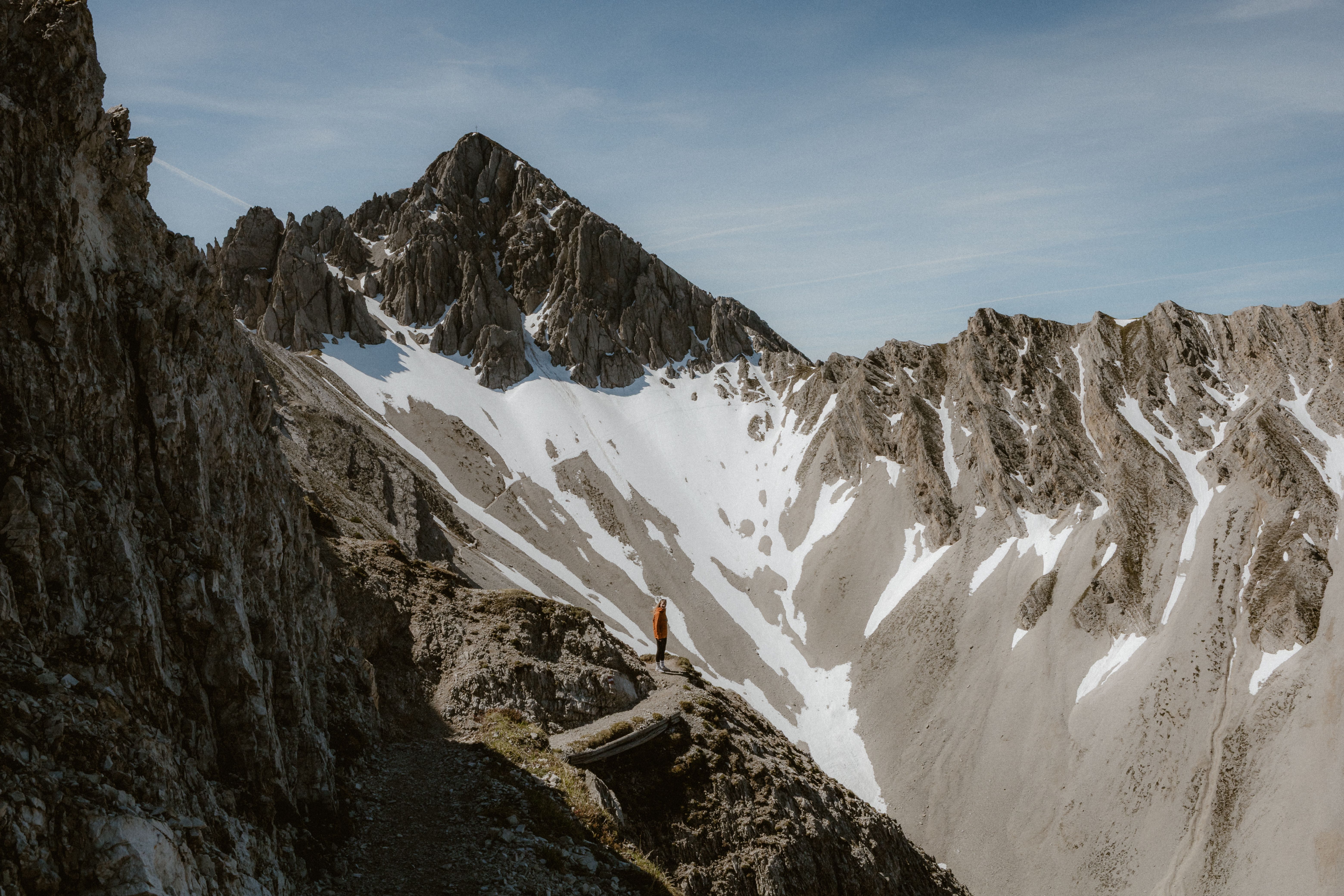 Dramatic Mountain Landscape with Lone Hiker · Free Stock Photo