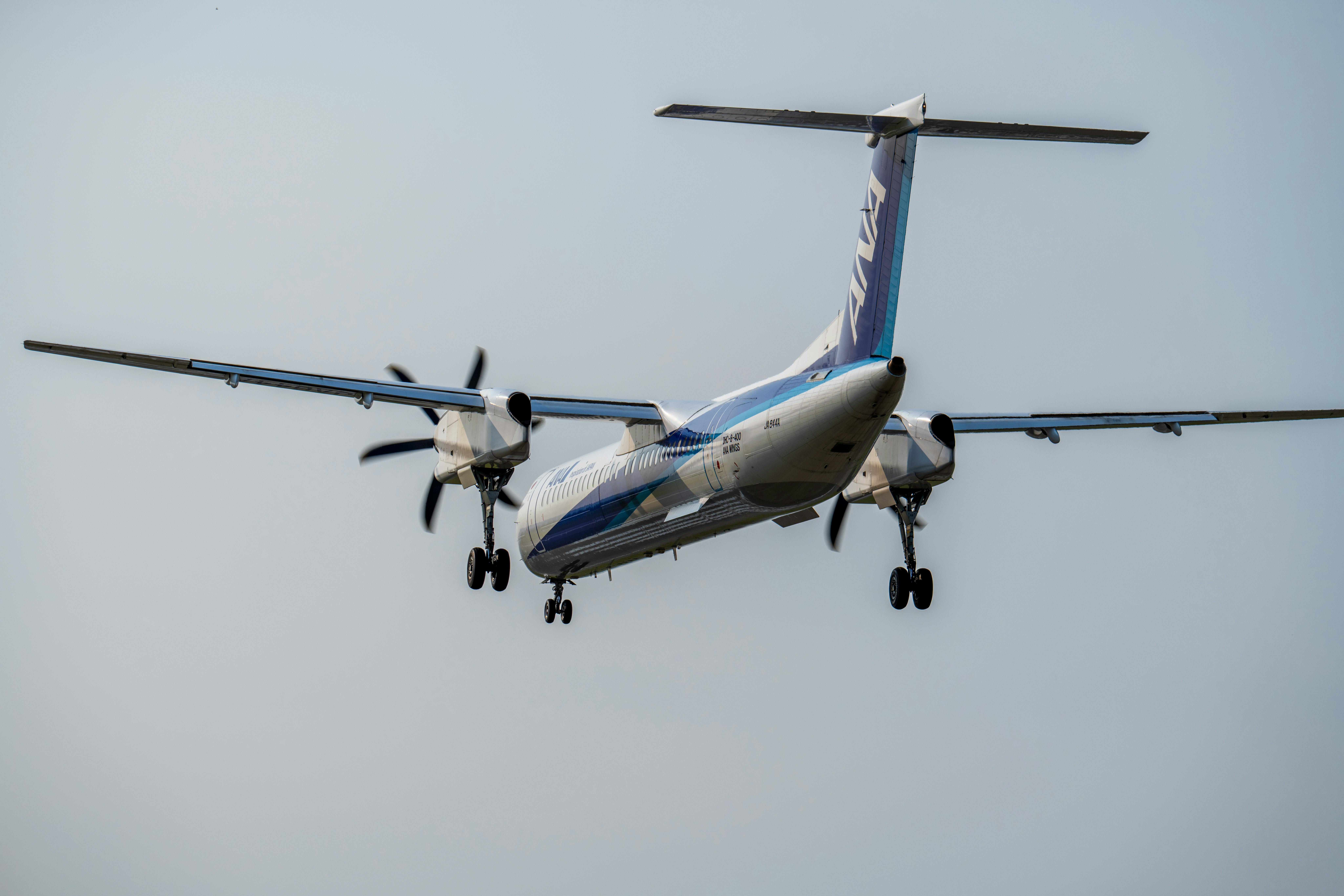 Rear View of Turboprop Aircraft in Flight · Free Stock Photo